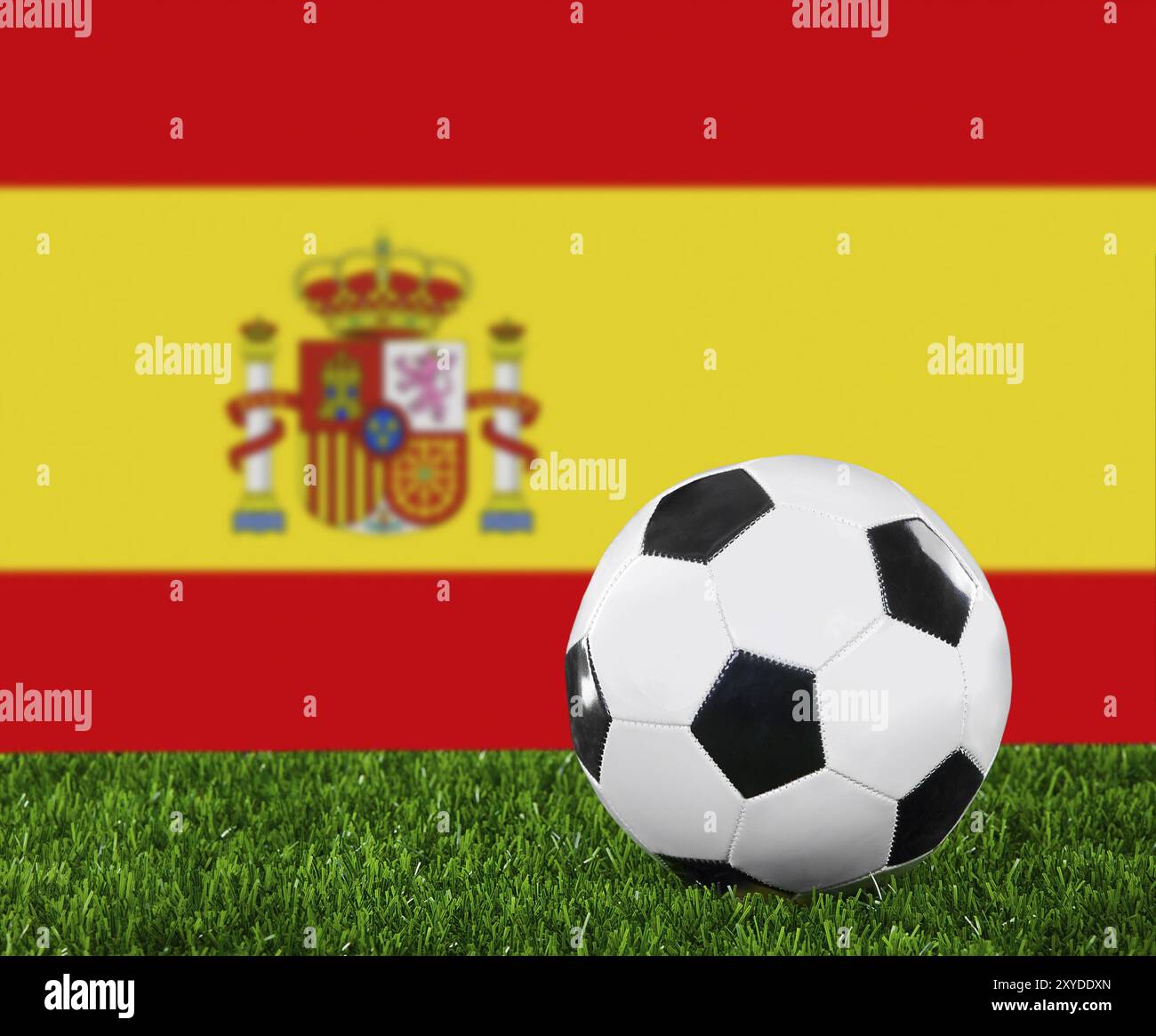 The Spanish flag and soccer ball on the green grass Stock Photo - Alamy