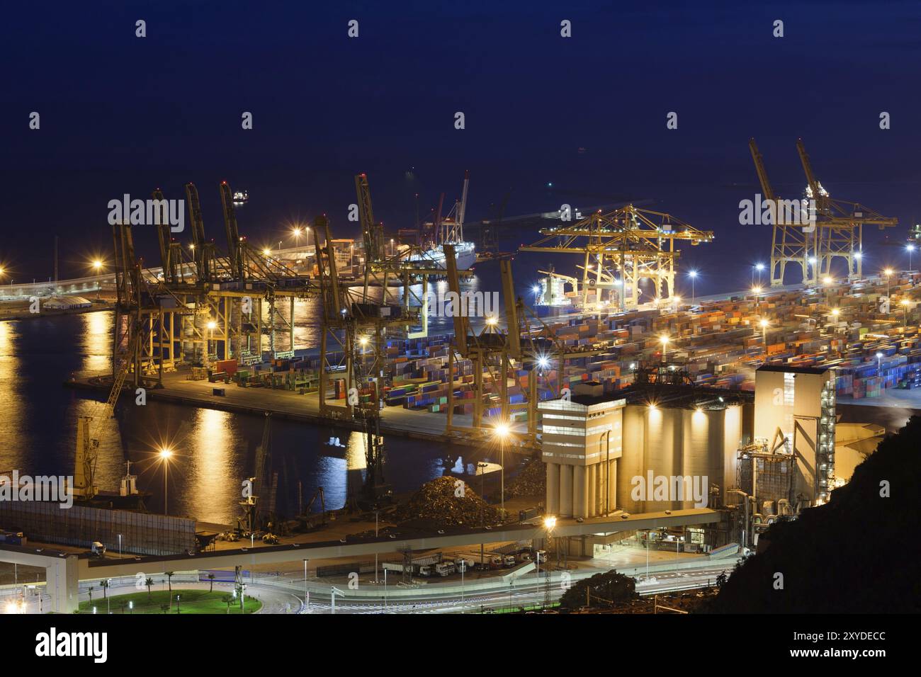 Port of Barcelona at night by Mediterranean Sea in Spain, industrial ...