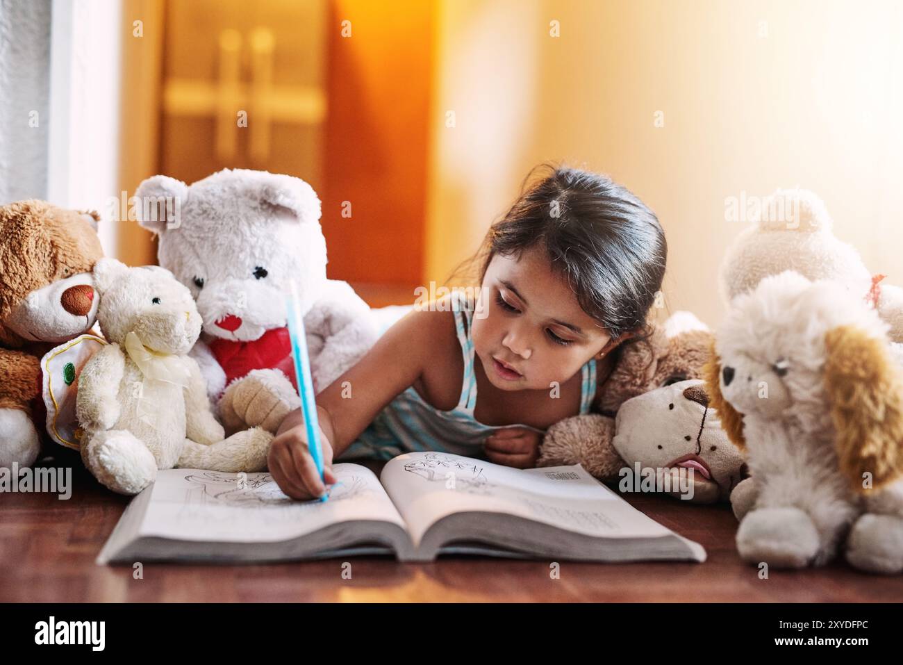 Book, toddler and girl writing for homework with learning, development ...