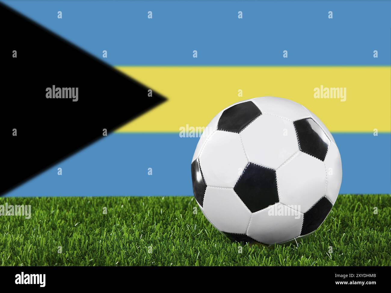 The Bahamas flag and soccer ball on the green grass Stock Photo - Alamy