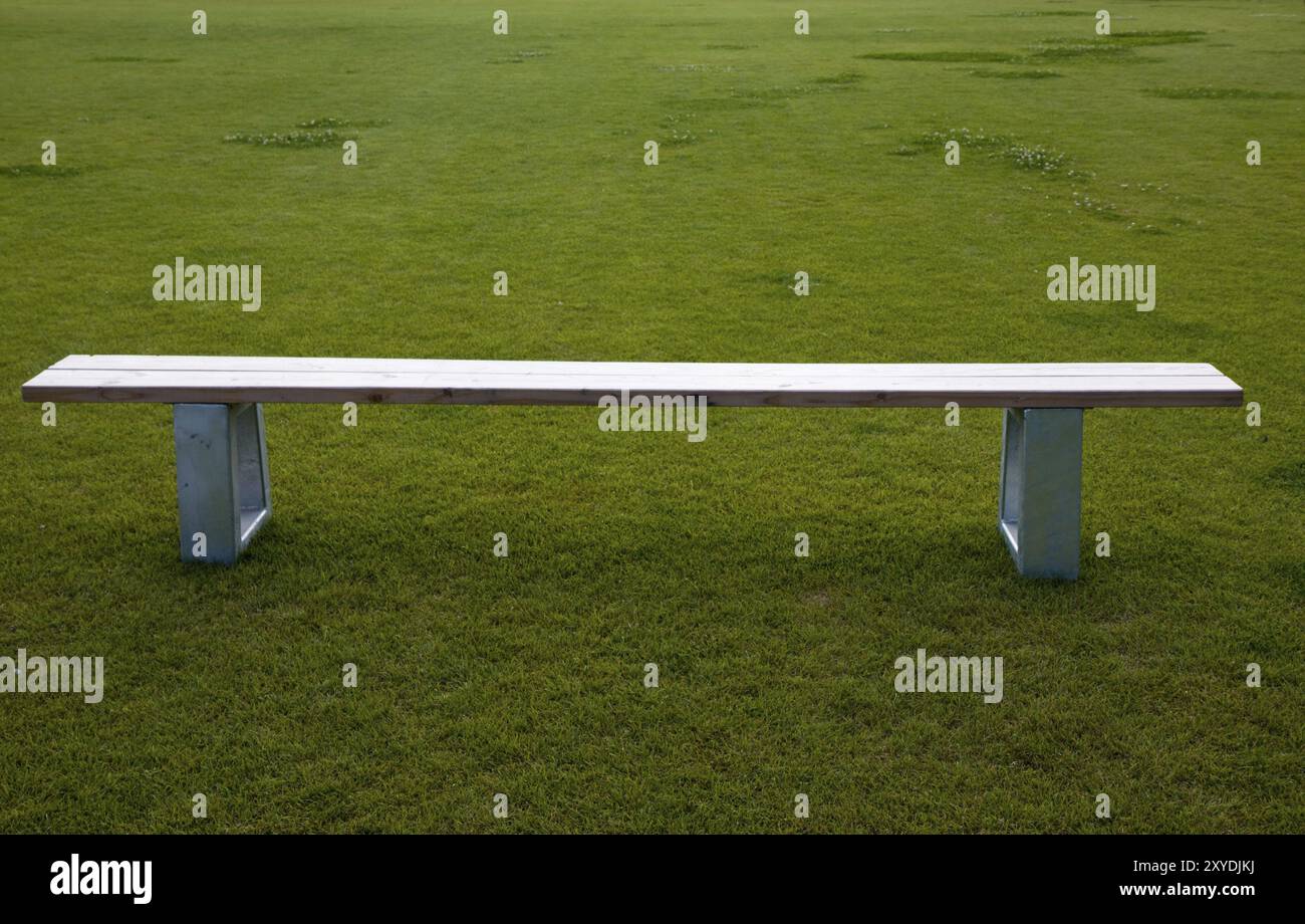 Bench on a football pitch Stock Photo - Alamy
