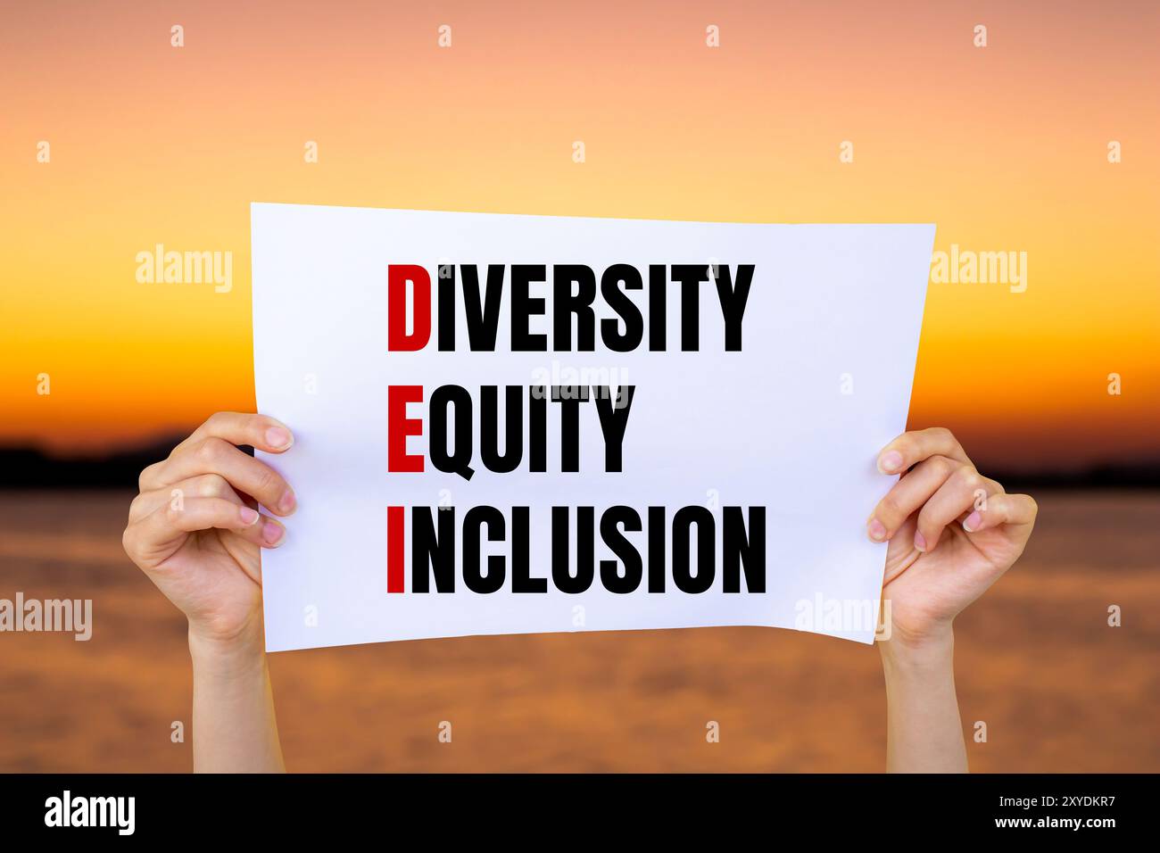 Diversity equity and inclusion words written on white paper with blurry ...