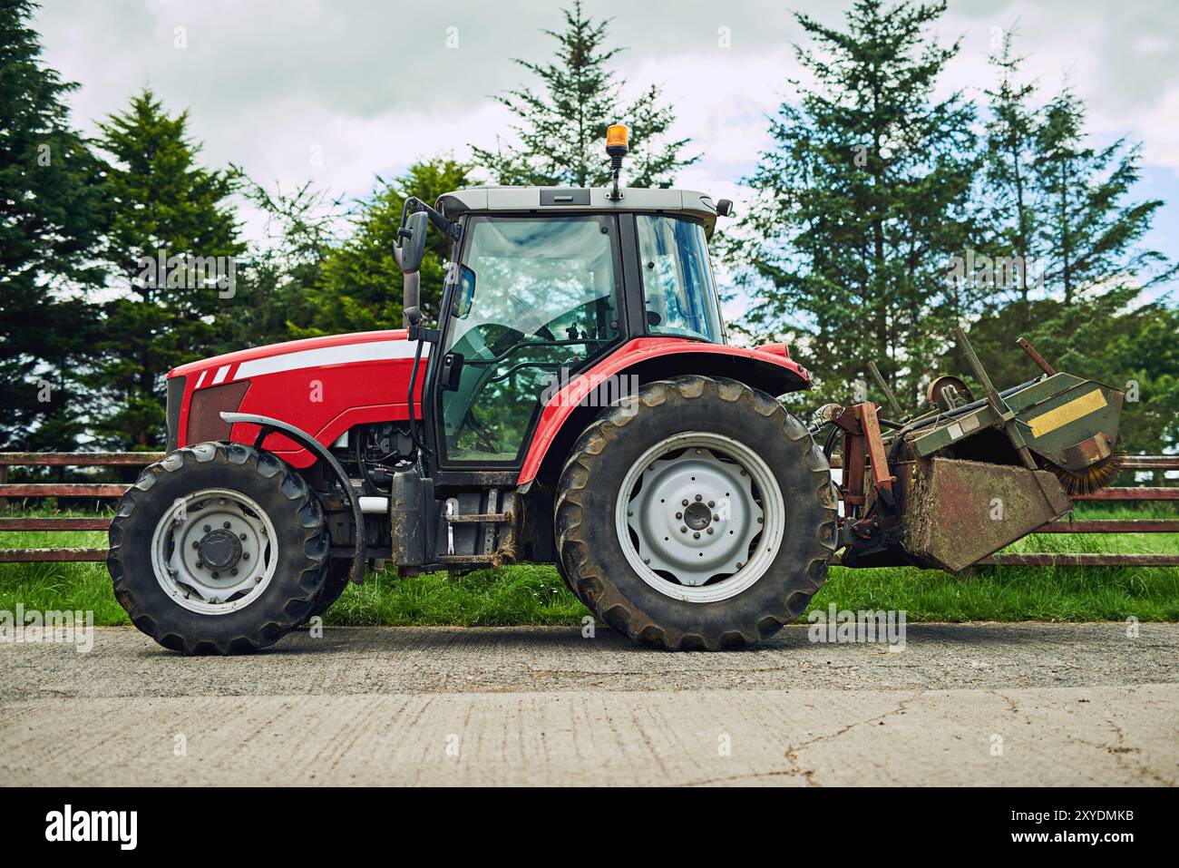 Outdoor, countryside and agriculture with tractor for driving, tiling ...