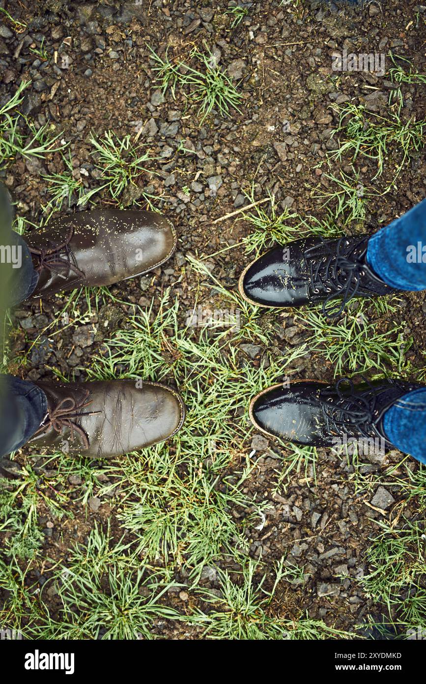 People, shoes and above with boots on farmland for agriculture, farming ...