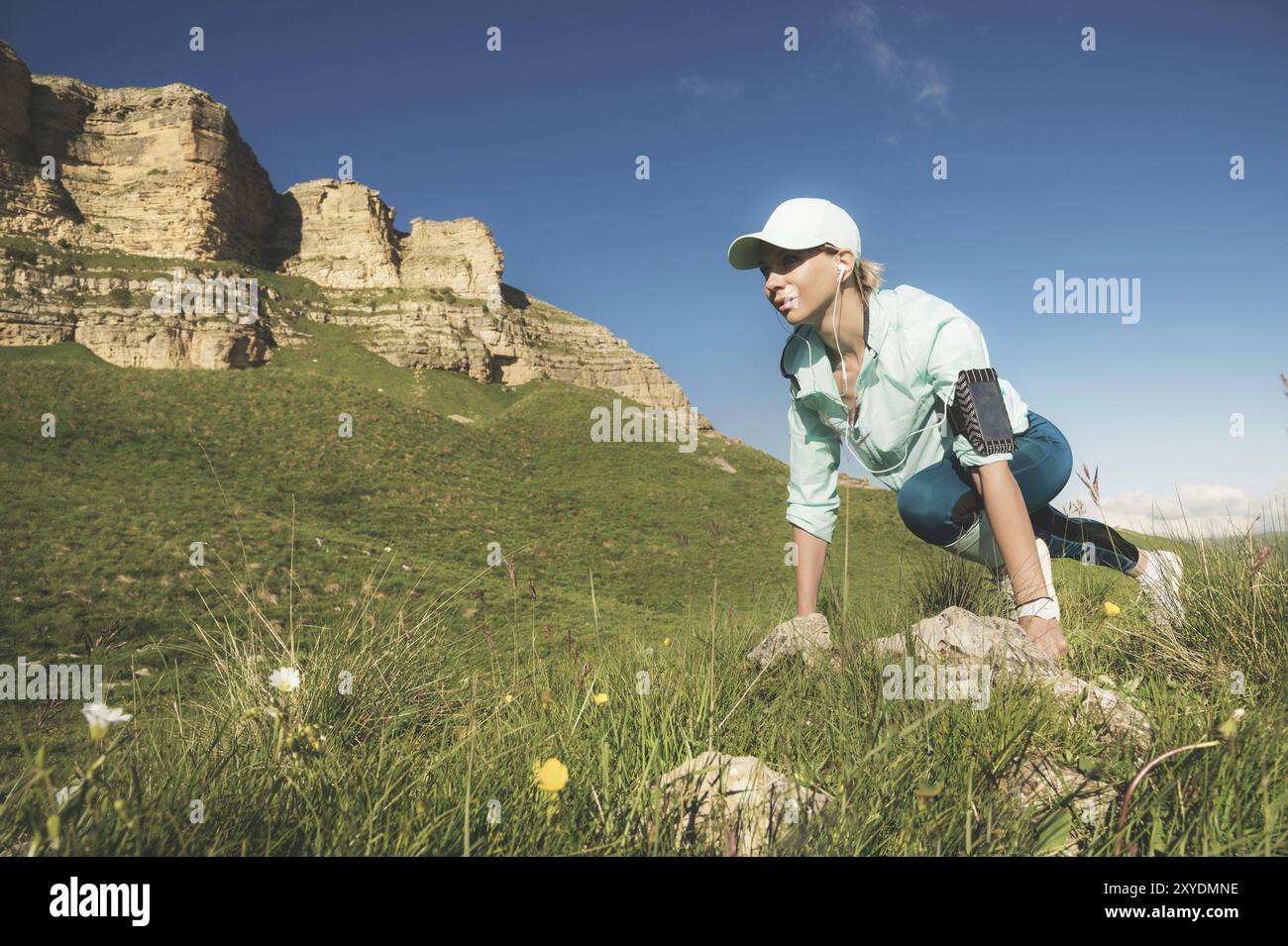 Athletic woman was ready to run at the foot of the rocks. Fitness ...