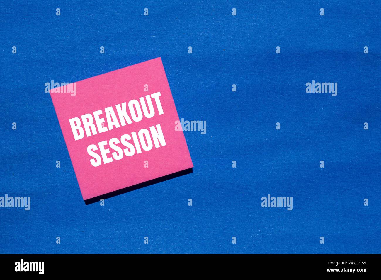 Breakout session message written on pink paper with blue background ...