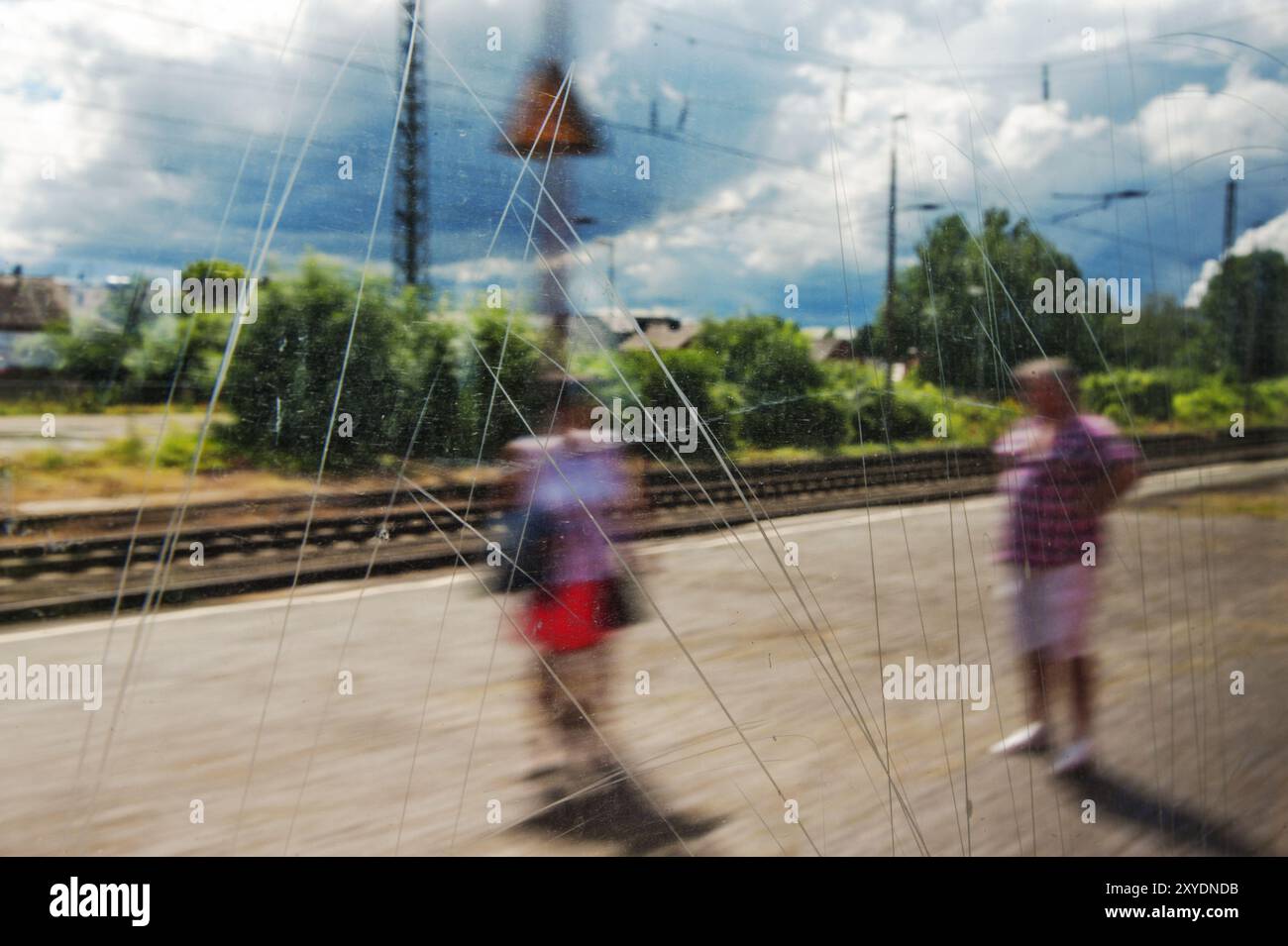 2 people standing on a platform Stock Photo - Alamy