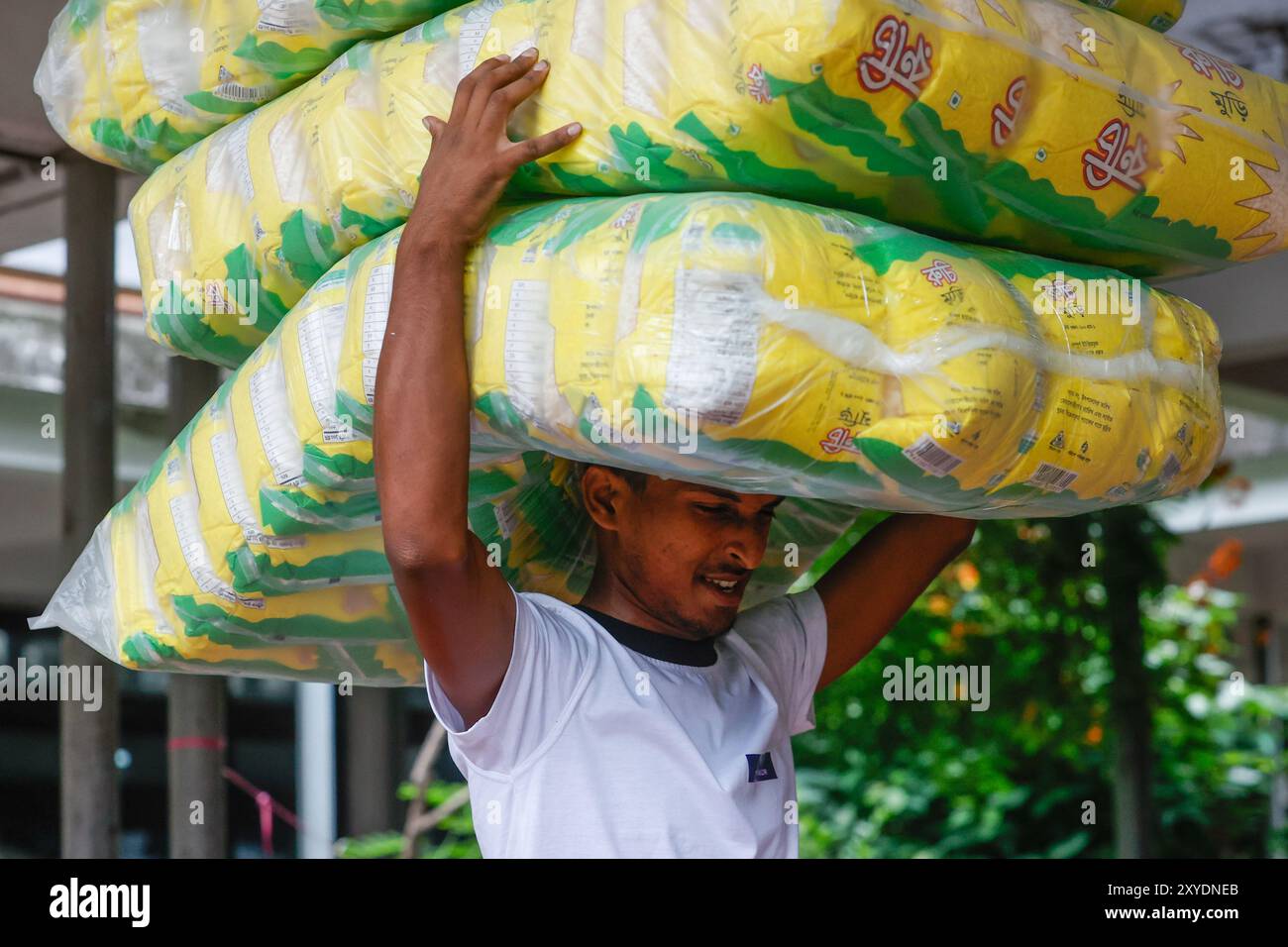 Student volunteers stocking, sorting and packaging relief materials ...