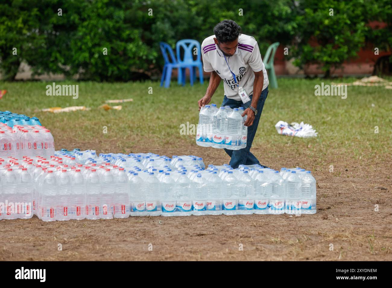 Student volunteers stocking, sorting and packaging relief materials ...