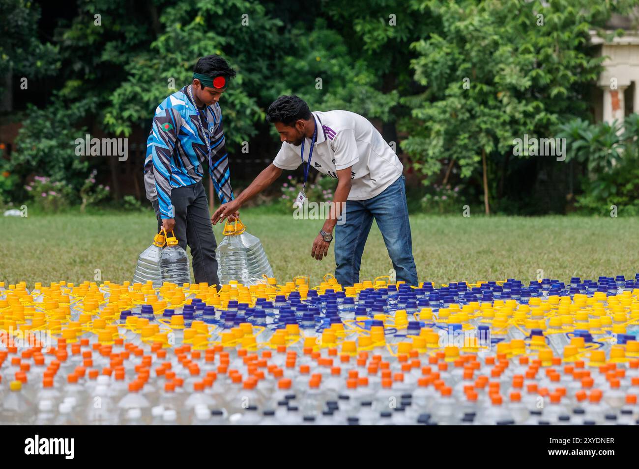Student volunteers stocking, sorting and packaging relief materials ...