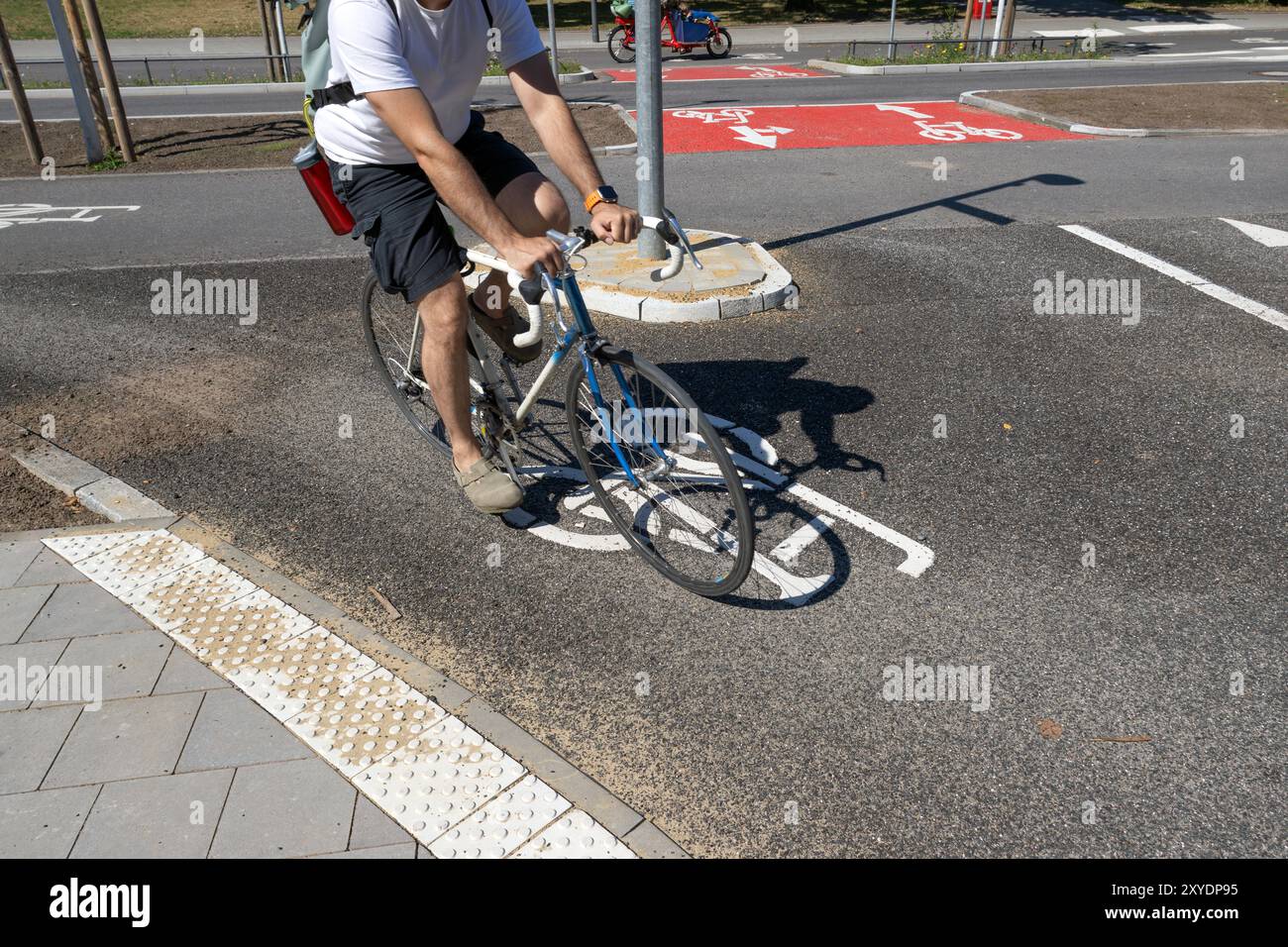Cyclist in the turning lane of the cycle traffic system Stock Photo - Alamy
