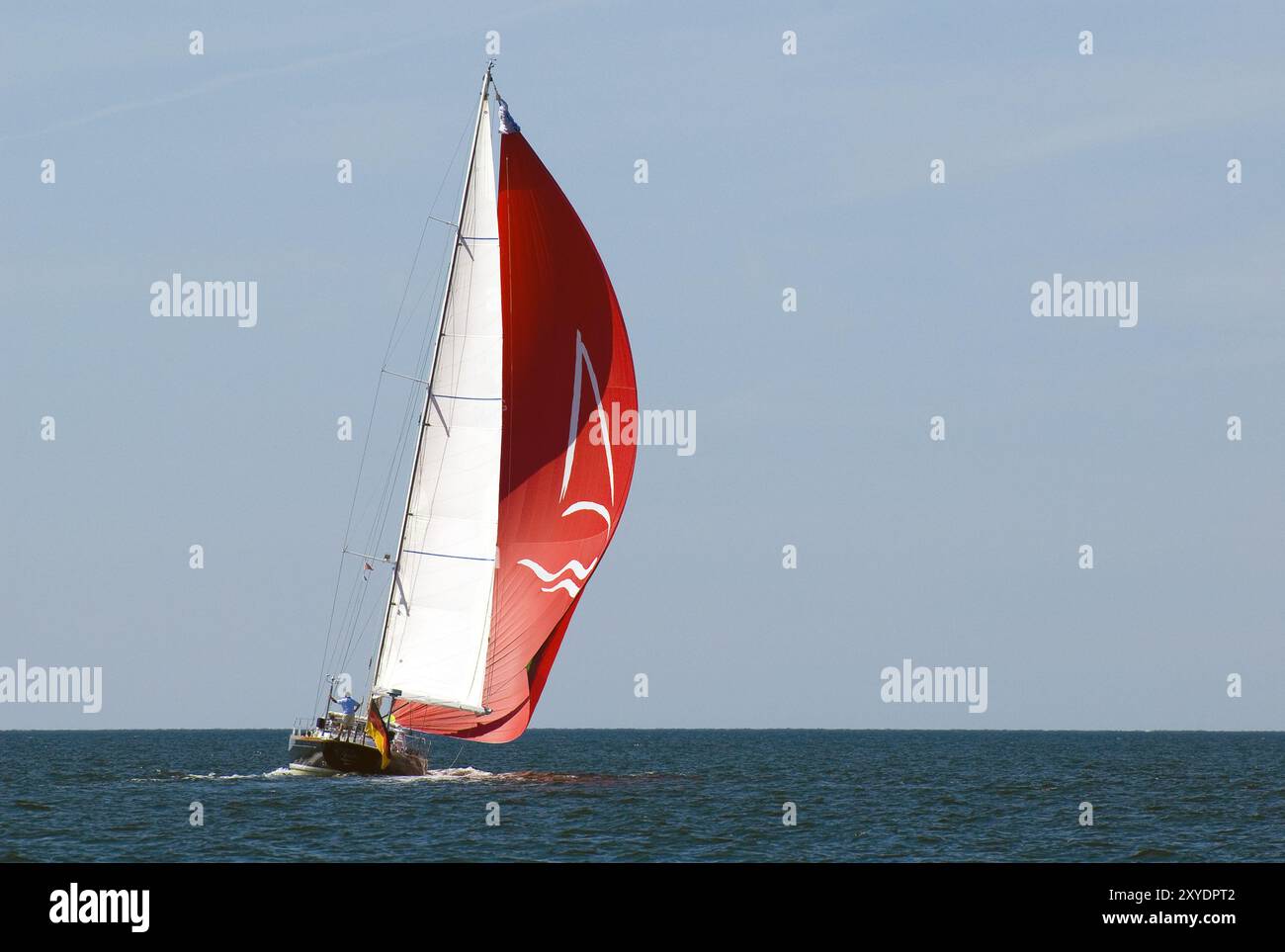 Sailing yacht with red jib Stock Photo - Alamy