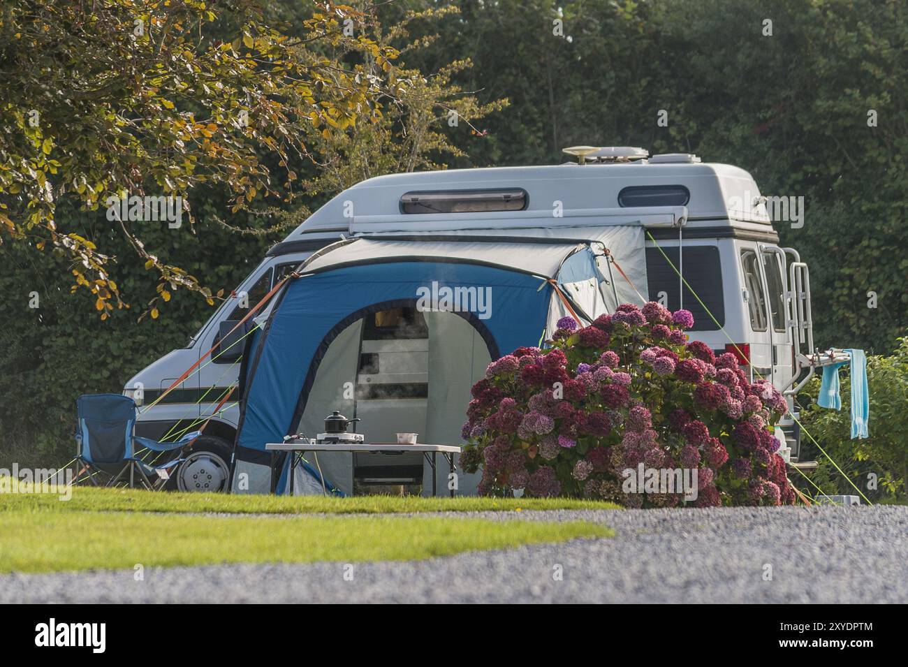 A caravan with awning stands on a campsite Stock Photo - Alamy