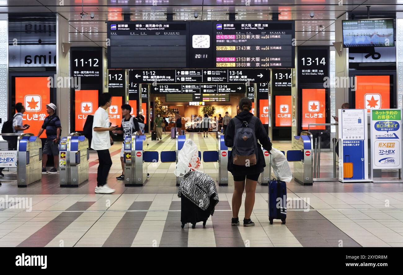 Photo shows a bulletin board announcing significant train delays due to ...
