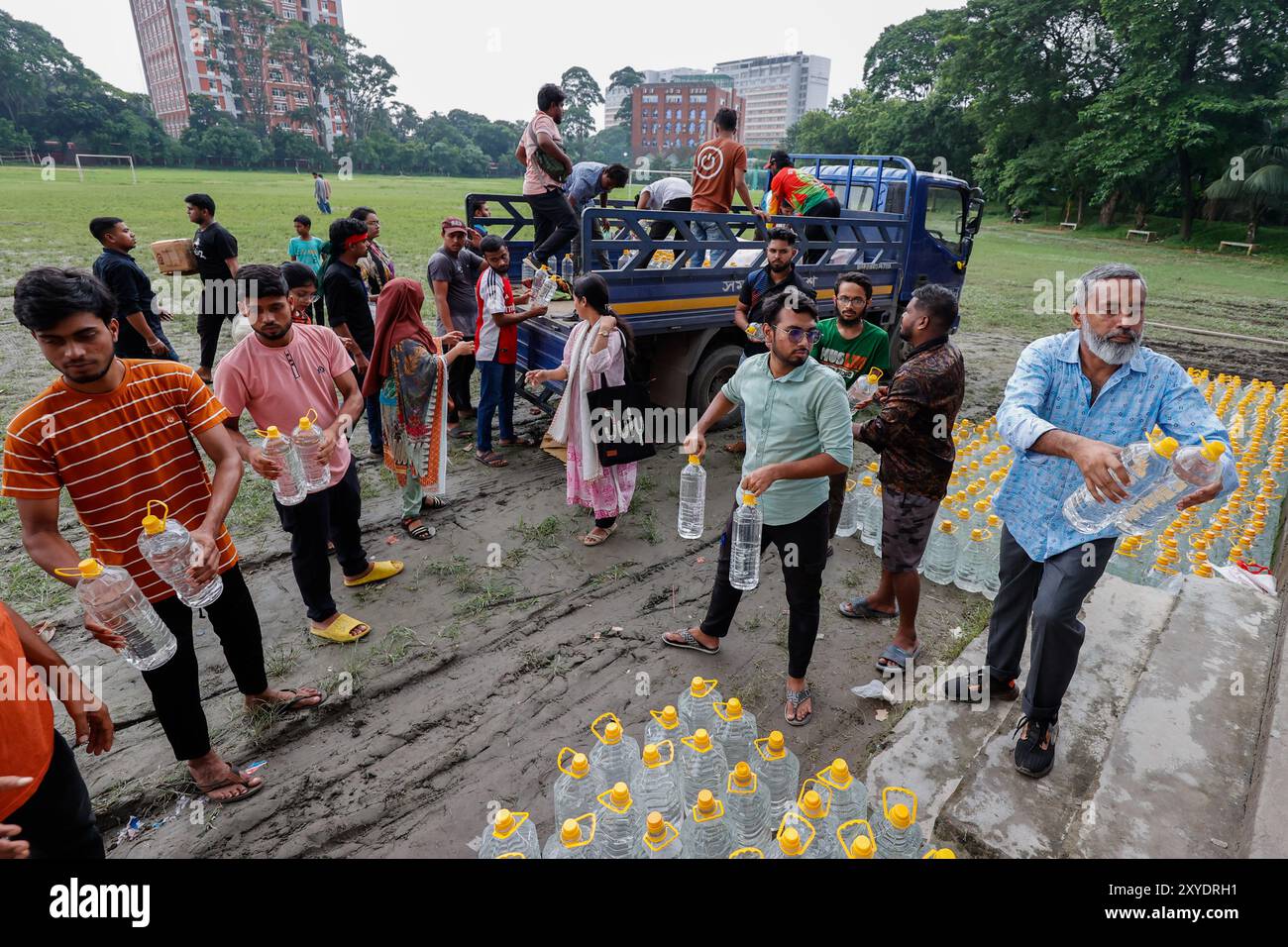 Student volunteers stocking, sorting and packaging relief materials in ...