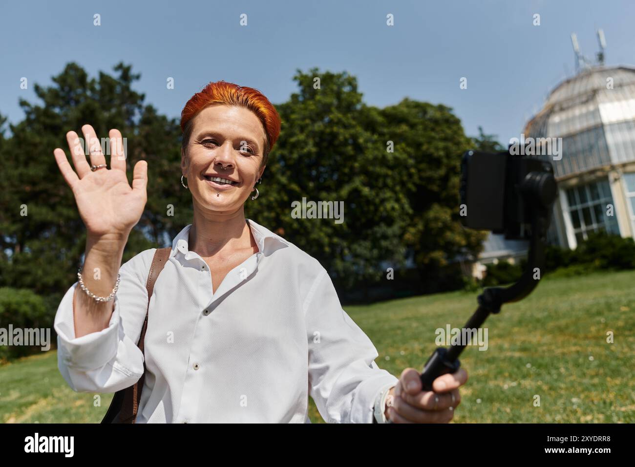 Young beautiful woman waves camera hi-res stock photography and images ...