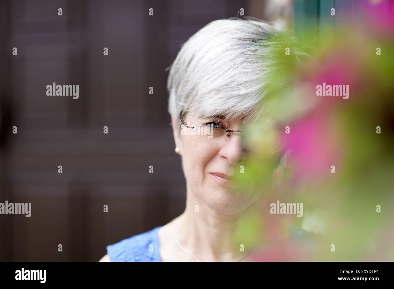 Woman gazes from behind hi-res stock photography and images - Alamy