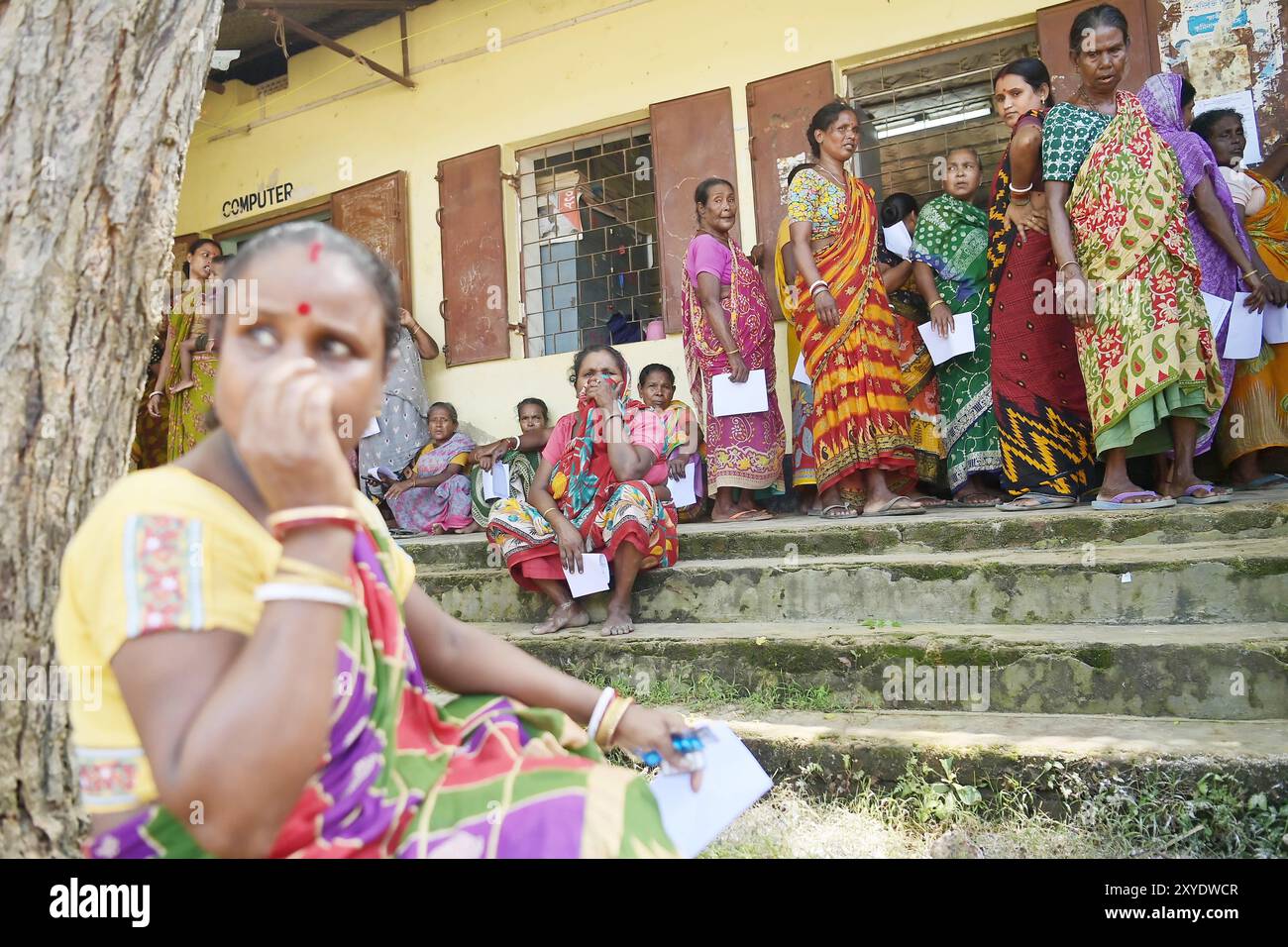Flood victims are queuing up during a health check-up at a temporary ...