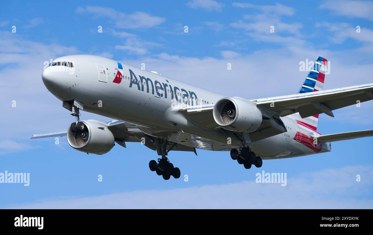 American Airlines Boeing 777 landing with a blue sky. London - 28th ...