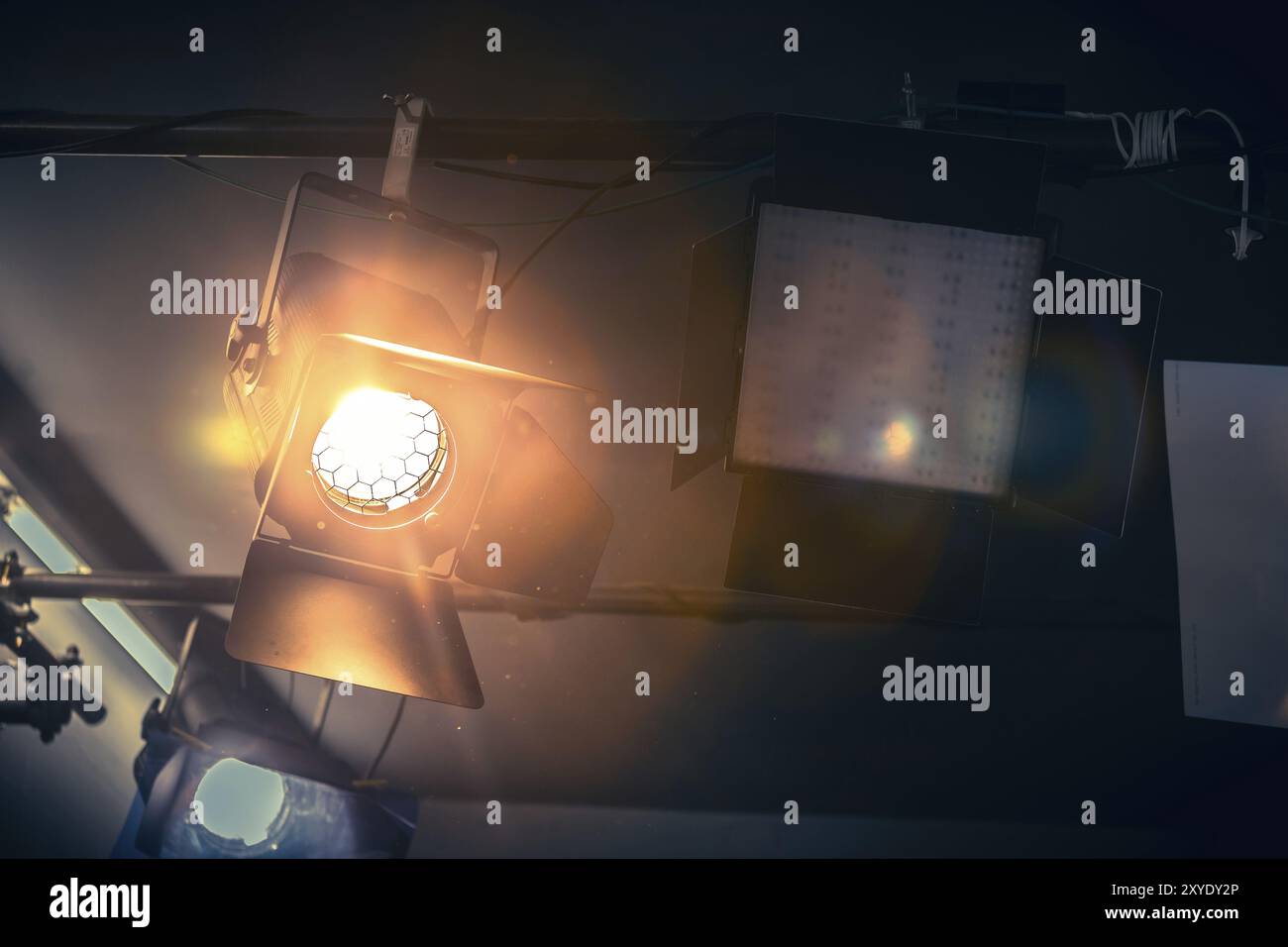 Professional orange studio spotlight hanging on the ceiling Stock Photo ...