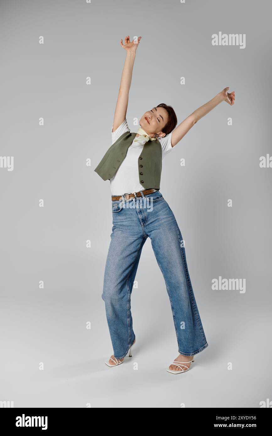 Confident woman poses arms hi-res stock photography and images - Alamy