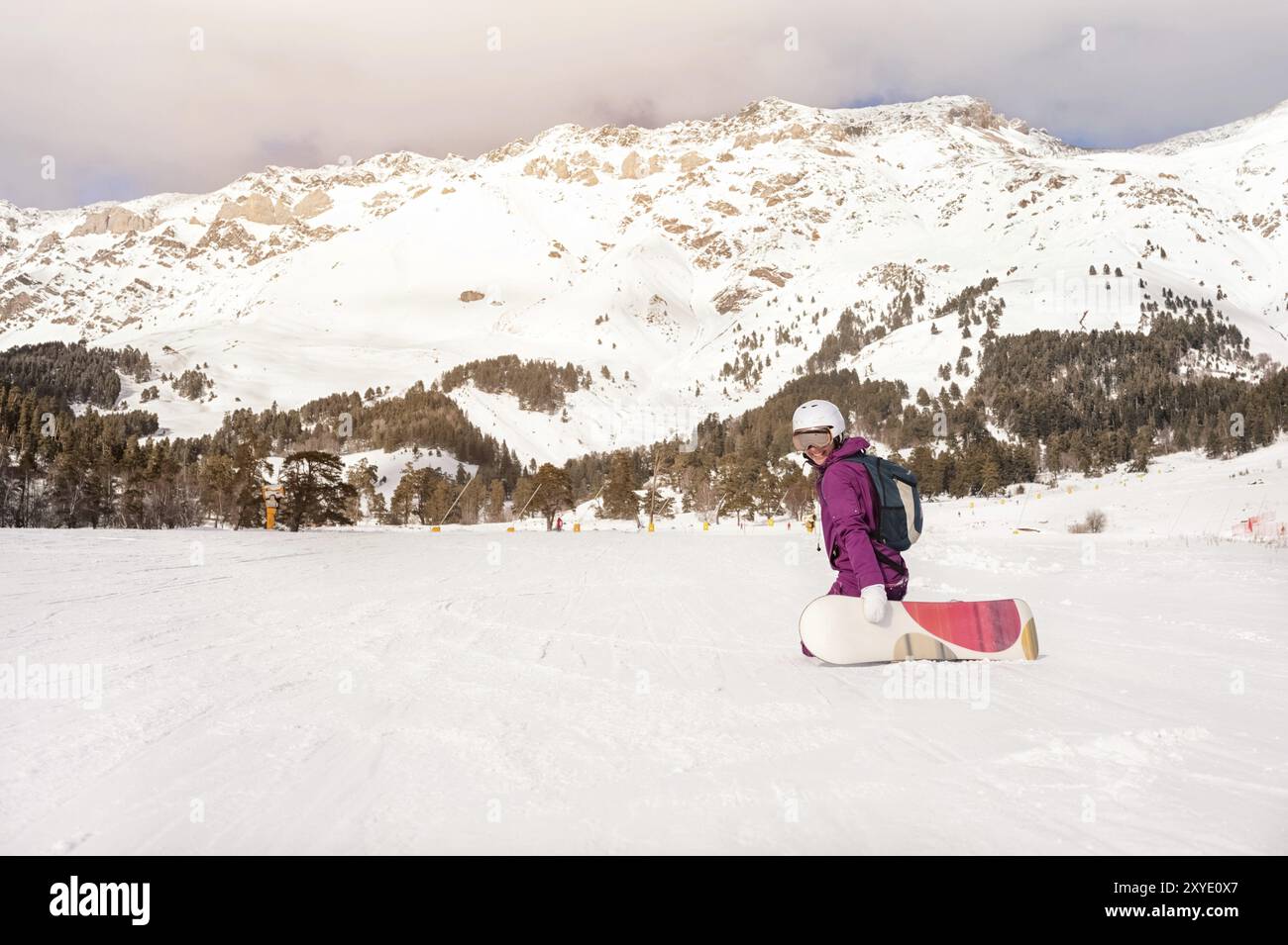 Female snowboarder in mountains hi-res stock photography and images - Alamy