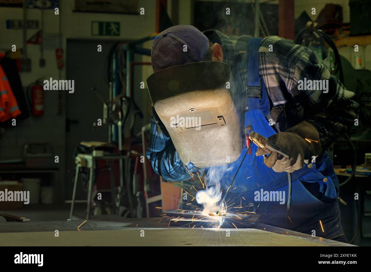 Welder in his workshop during electric welding Stock Photo - Alamy