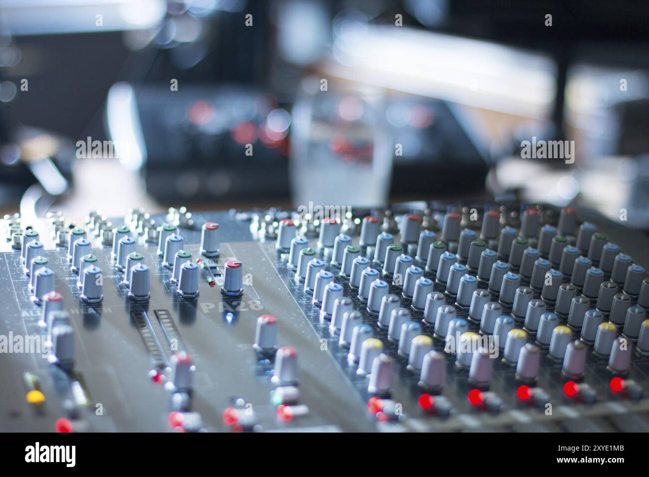 Professional music production in a sound recording studio, mixer desk ...