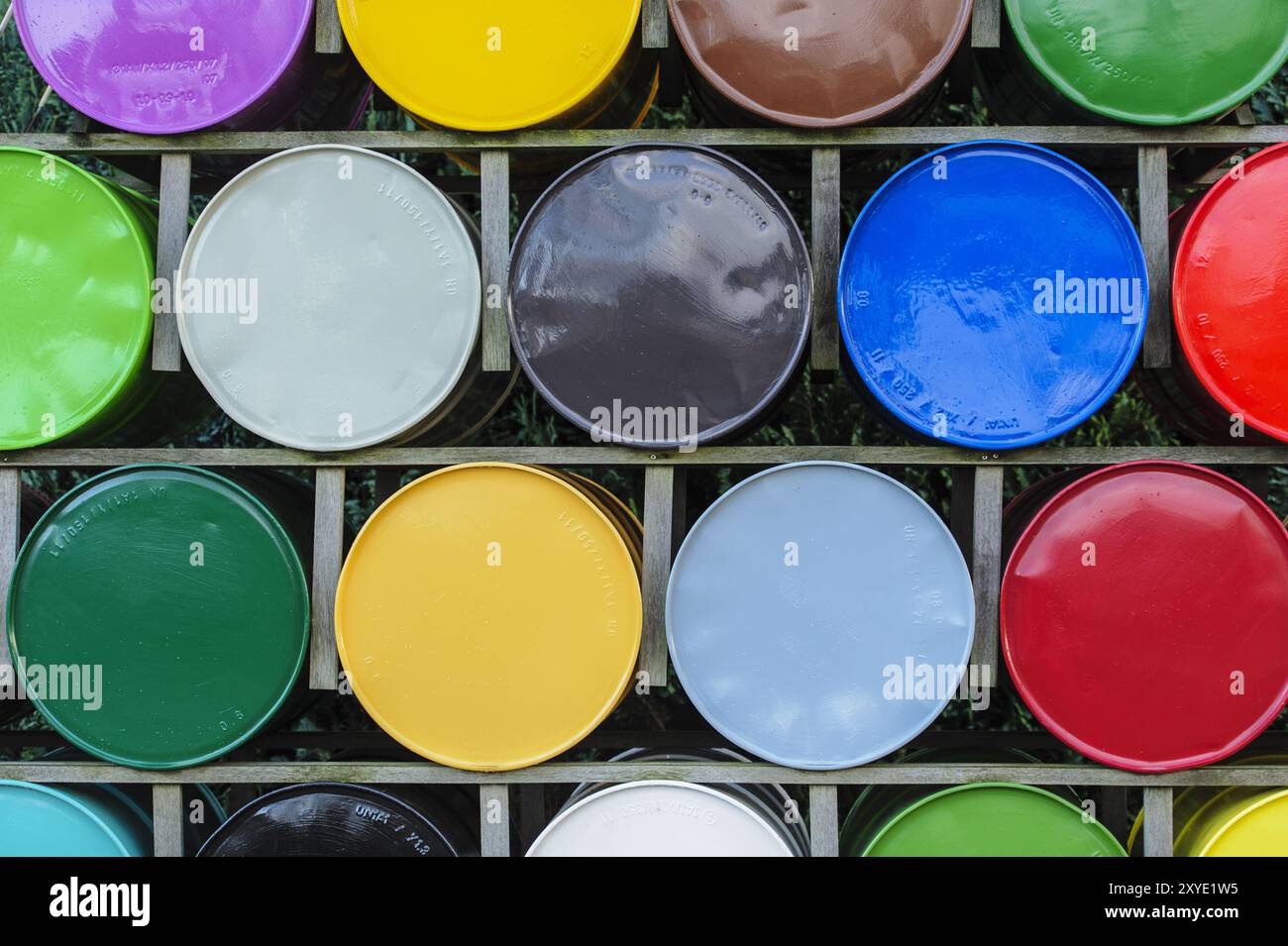 A stack of colourful paint drums Stock Photo - Alamy
