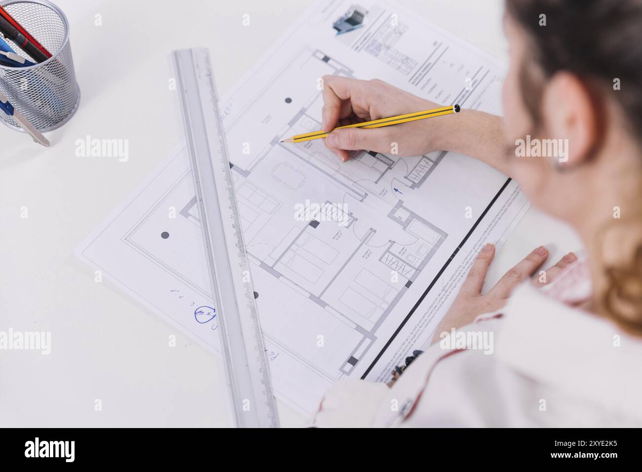 From woman drawing blueprint Stock Photo - Alamy