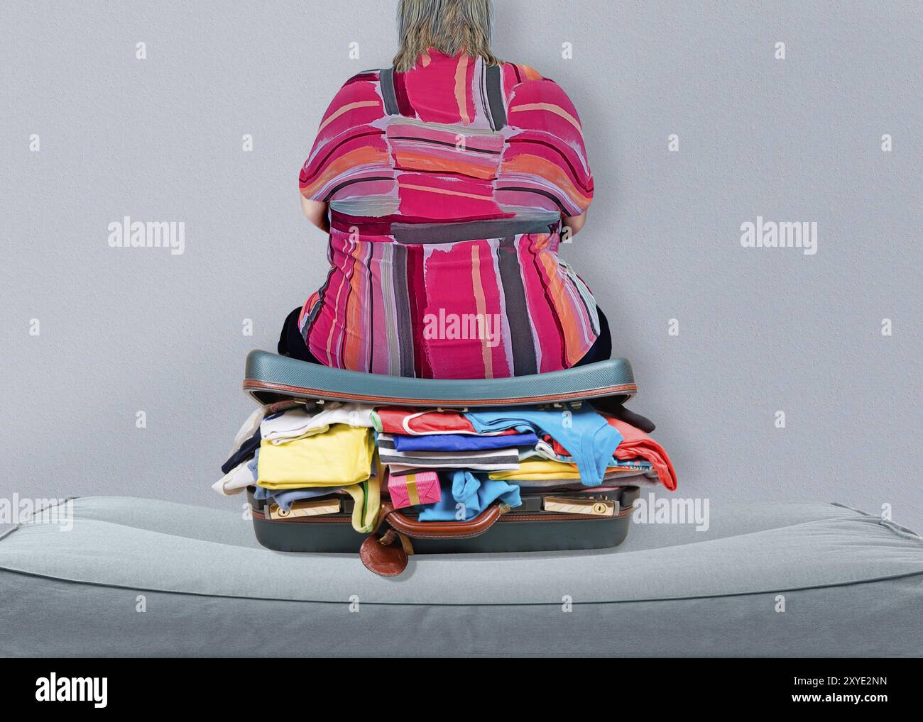 Woman packs suitcase hi-res stock photography and images - Alamy
