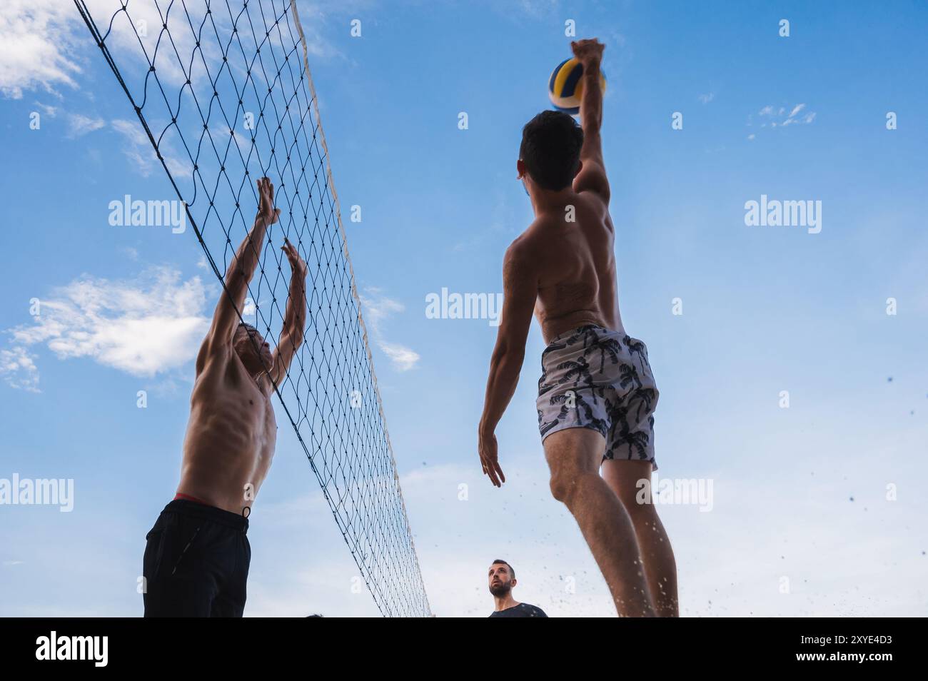 Teams with multinational players play beach volleyball on the beach in ...