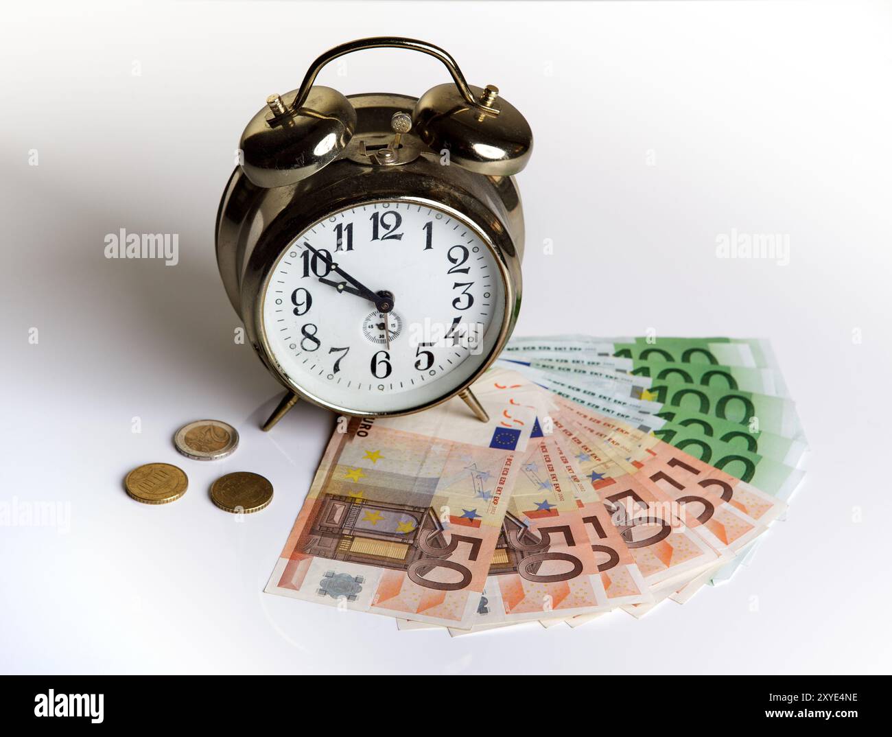 Euro notes with old mechanical clock, time is money Stock Photo - Alamy