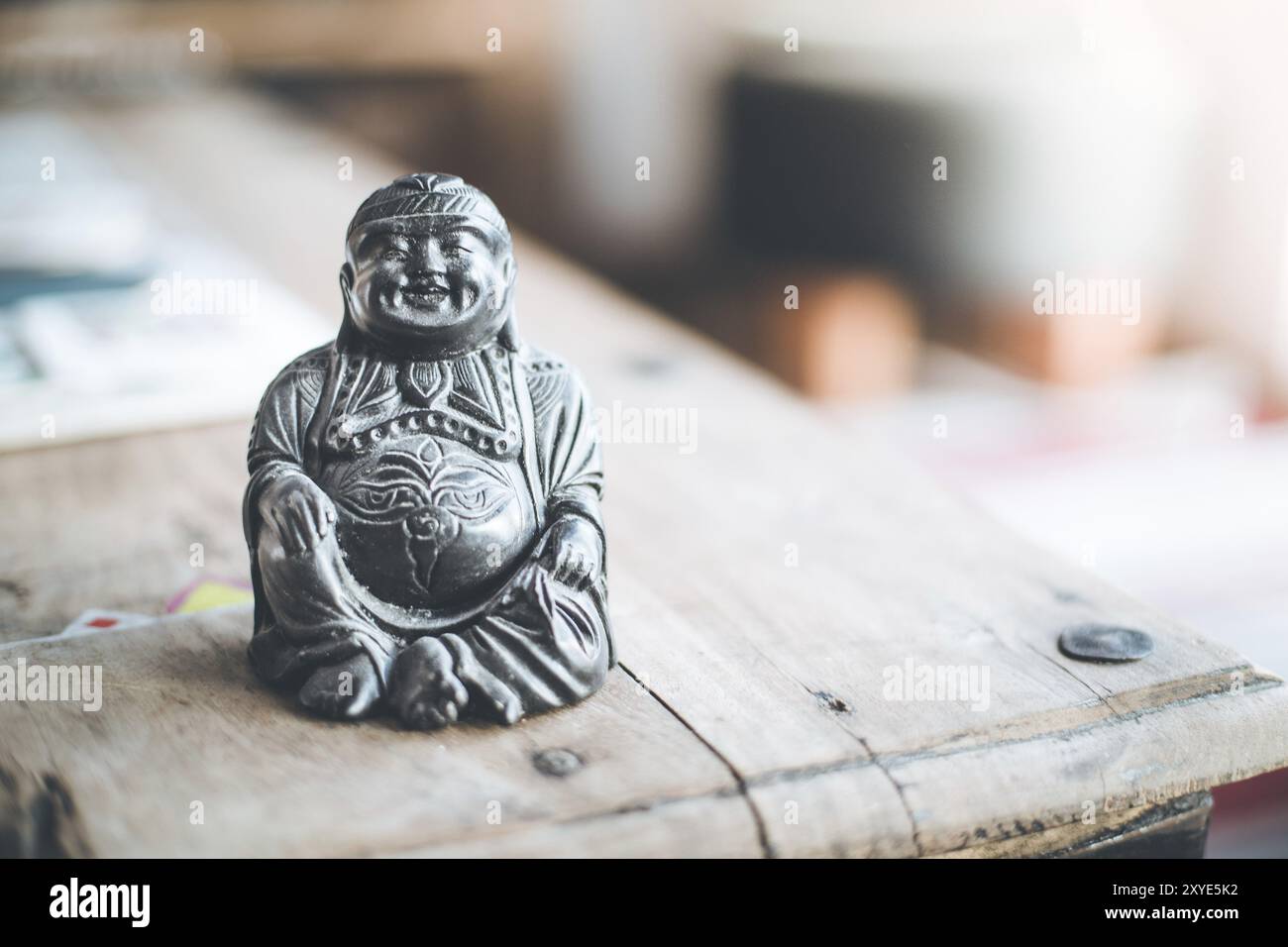 Feng shui: Buddha statue at on a table in the own living room Stock ...