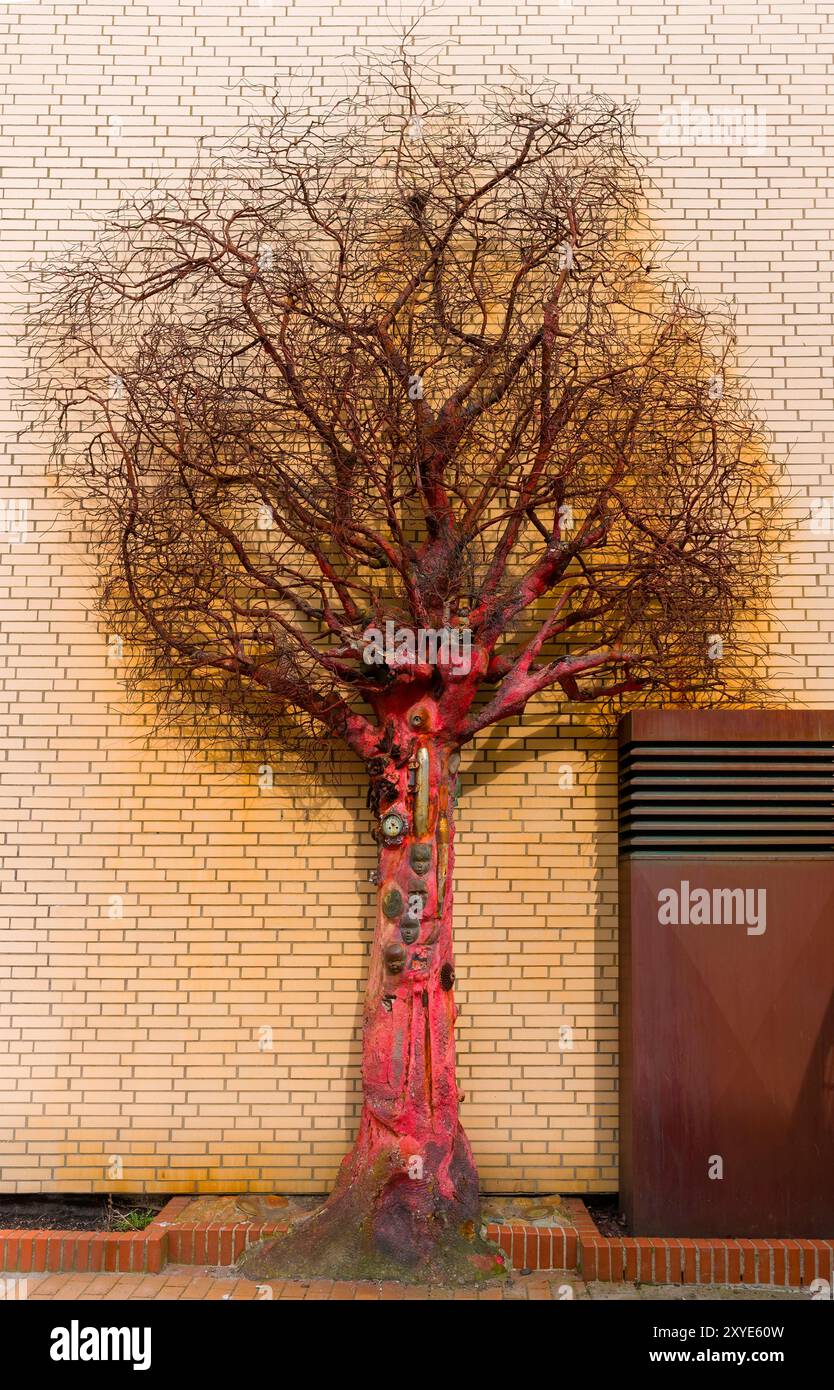 A rust-red metal tree on a house wall, island of Sylt, Westerland Stock ...