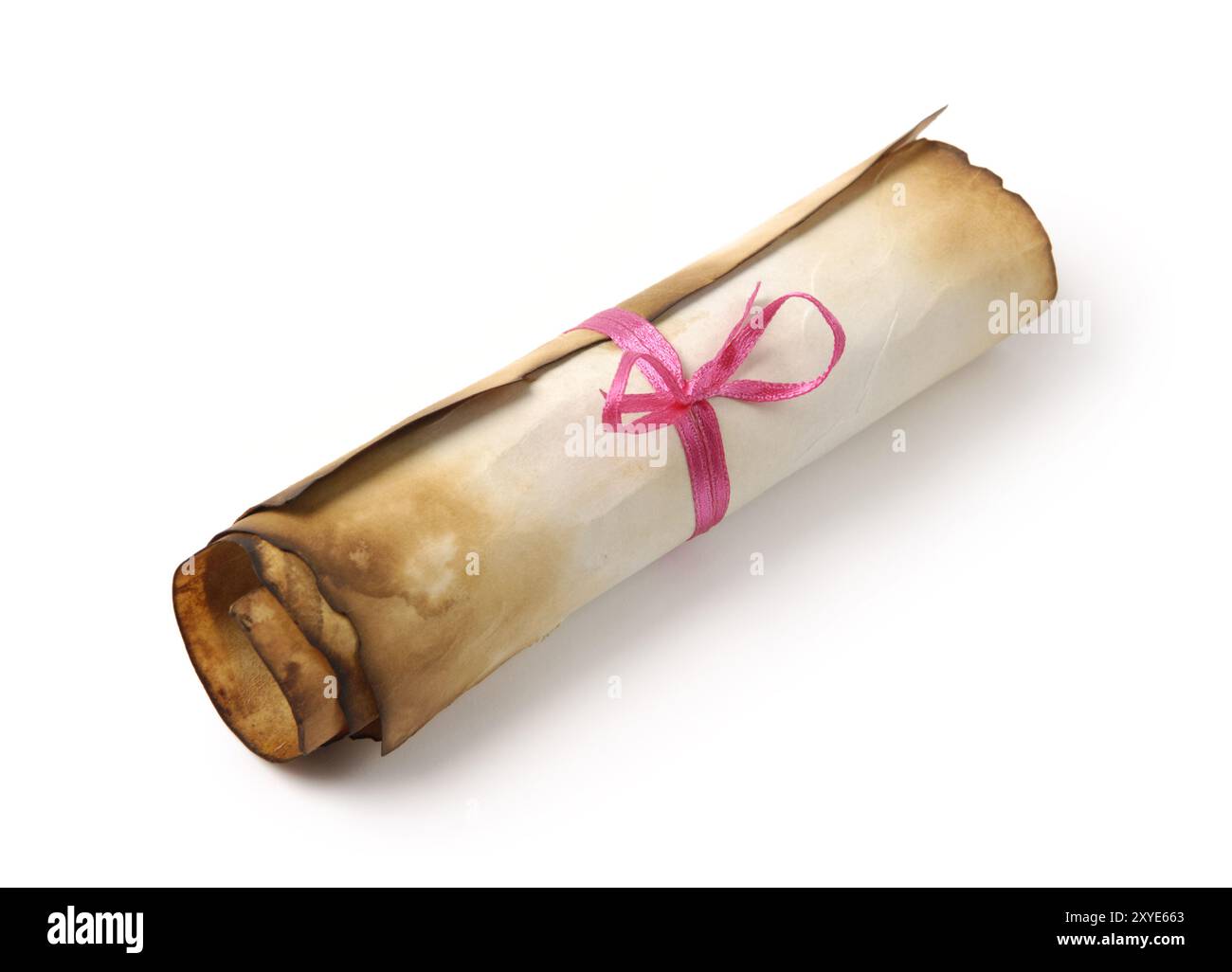 Roll of yellowish burnt vintage parchment tied with a red ribbon ...