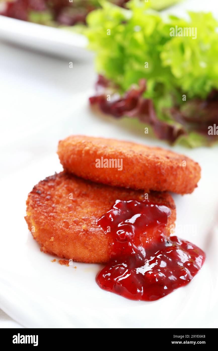 Baked Camembert with Cranberry Sauce and mixed salad Stock Photo - Alamy