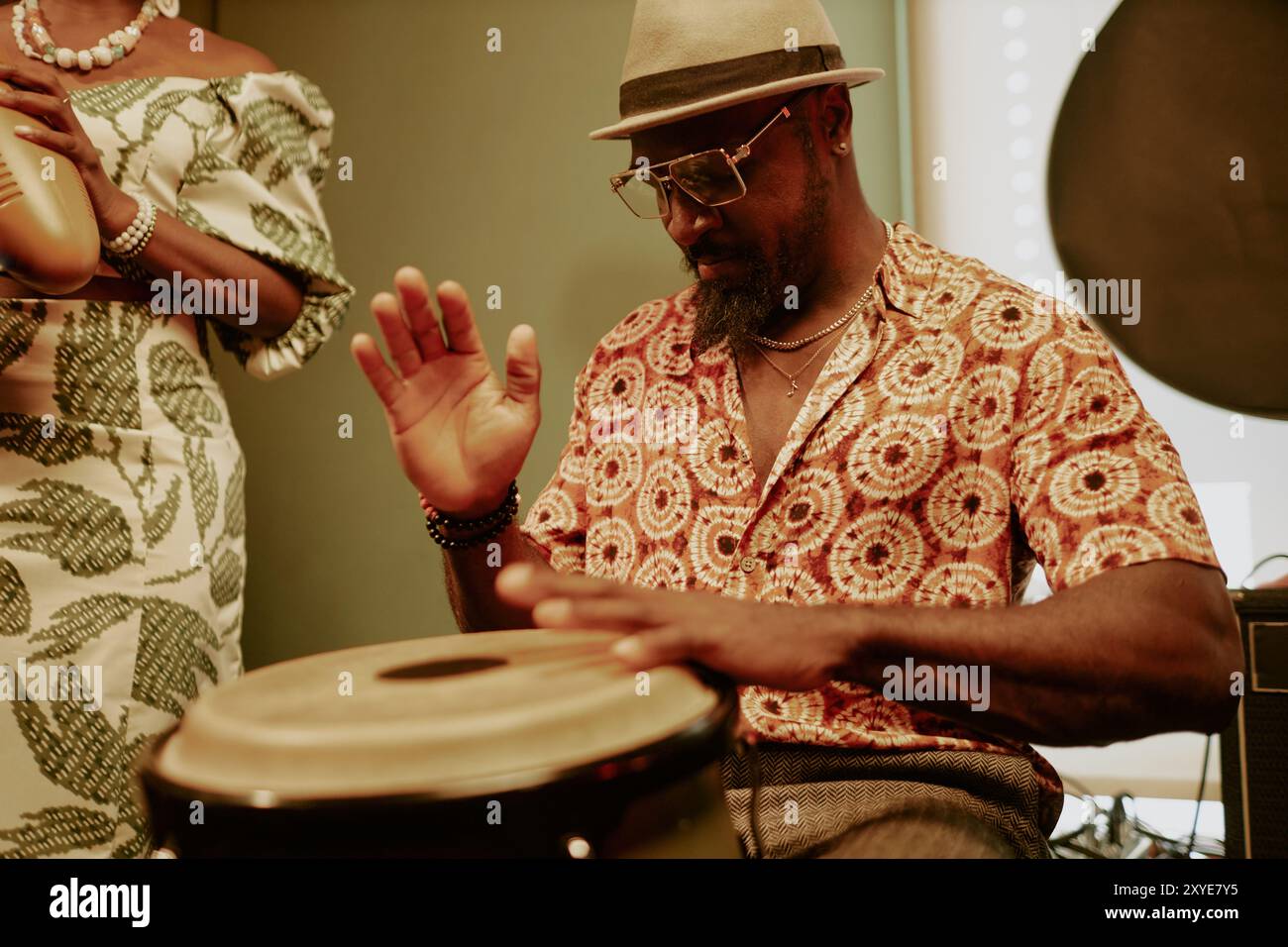 Black Man Playing Conga Instrument Stock Photo - Alamy