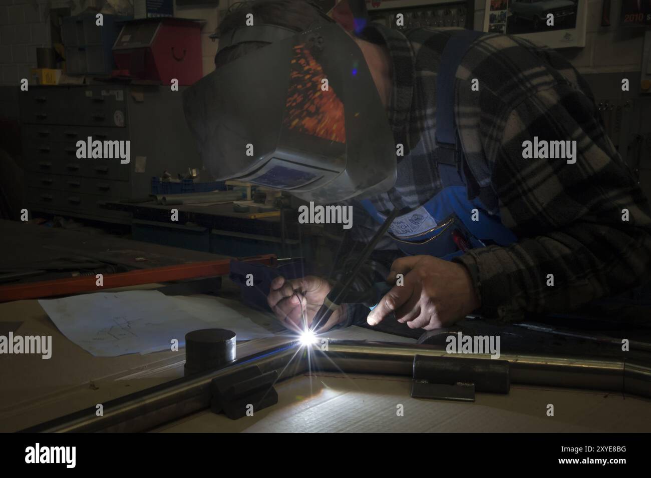 Welder in his workshop during welding work Stock Photo - Alamy