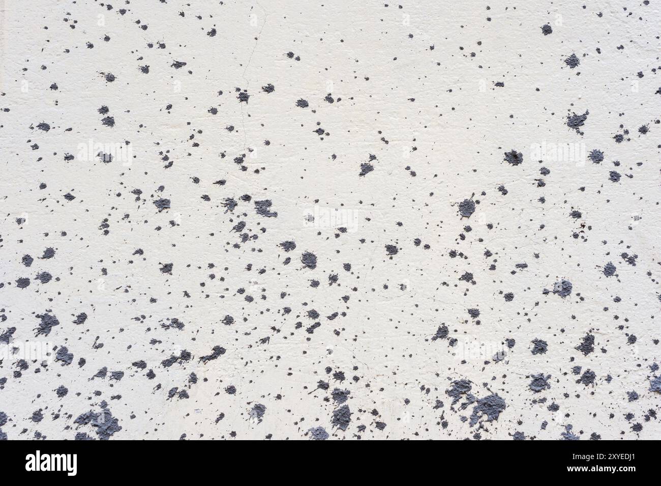 Texture A white, slightly cracked wall is carelessly stained with a ...