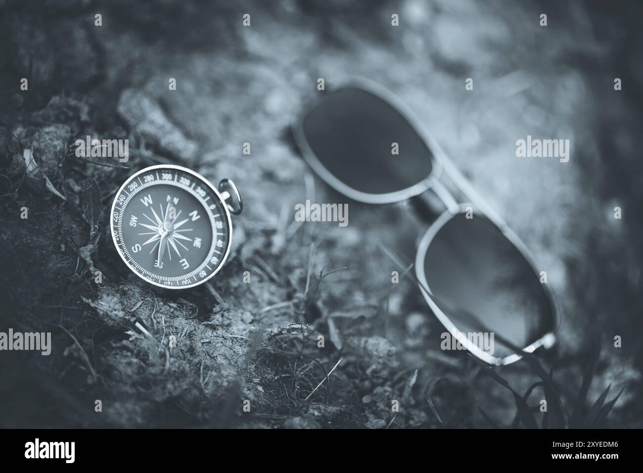 Vintage compass and sunglasses lying on the floor. Adventure and ...