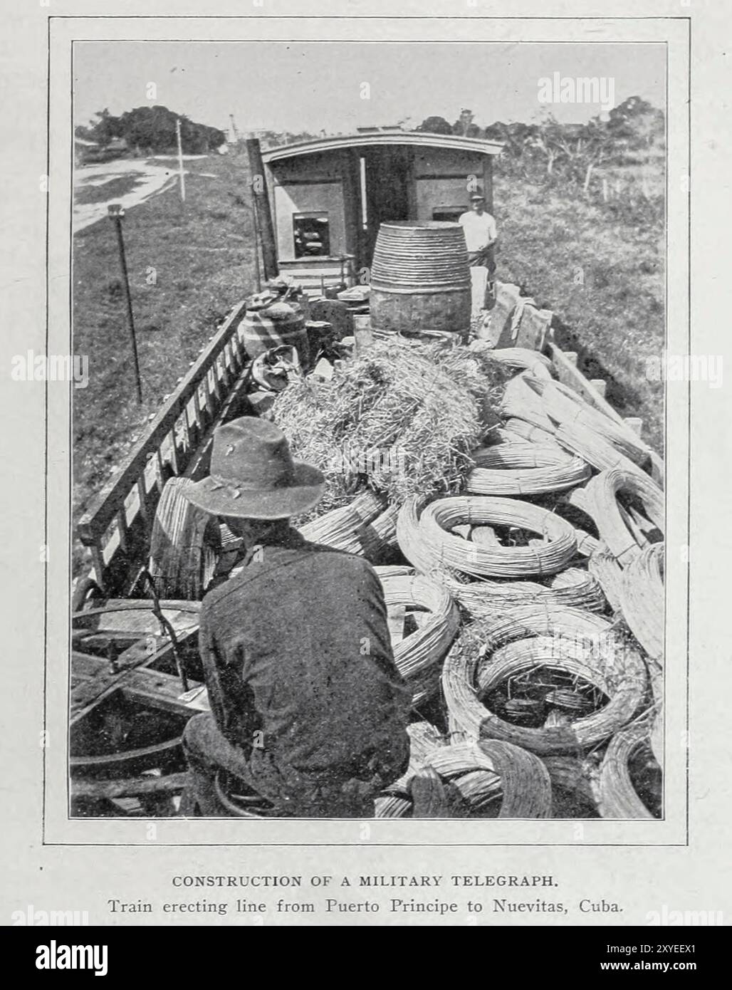 CONSTRUCTION OF A MILITARY TELEGRAPH. Train erecting line from Puerto ...