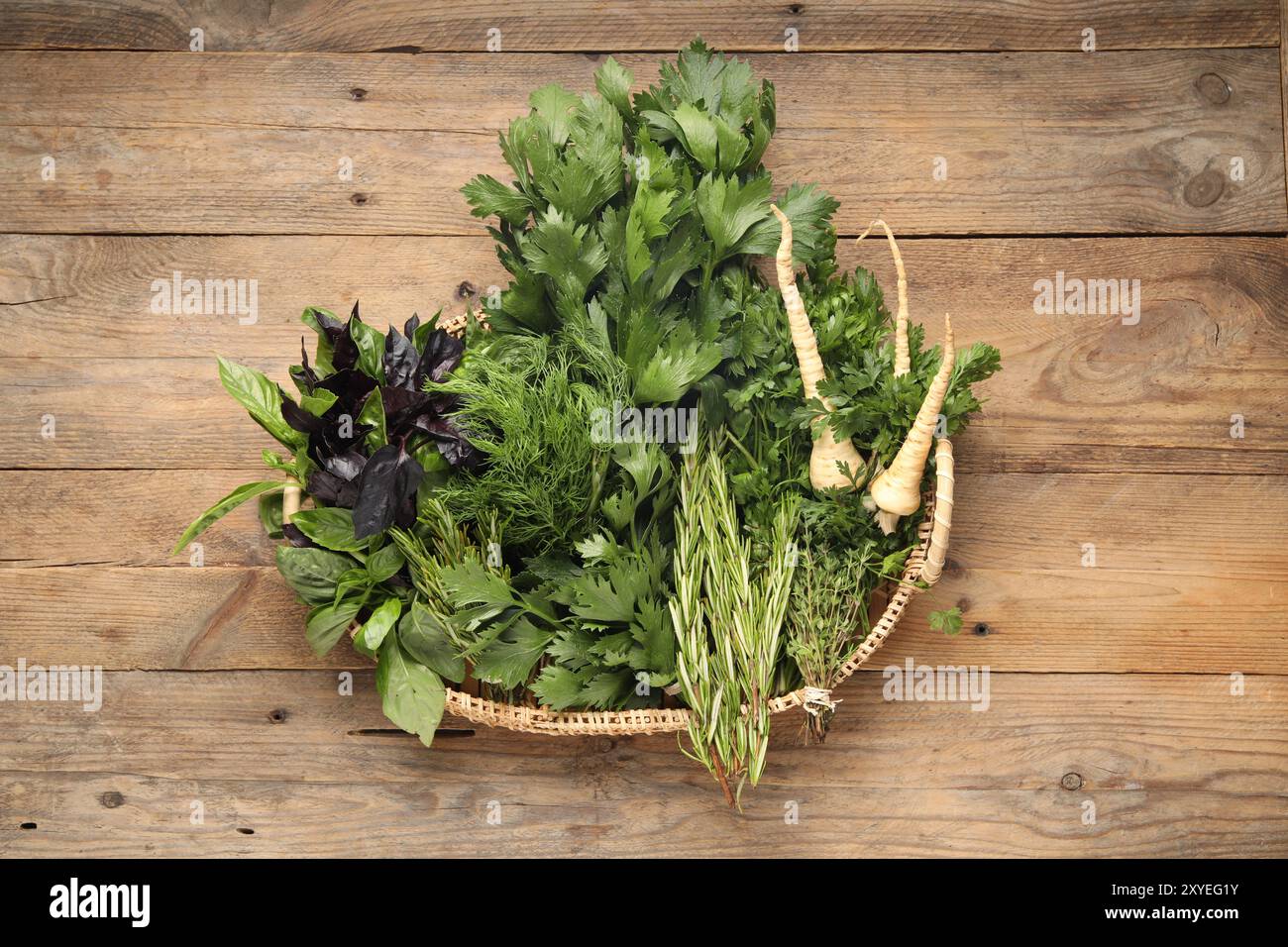 Herbs in wicker basket hi-res stock photography and images - Alamy