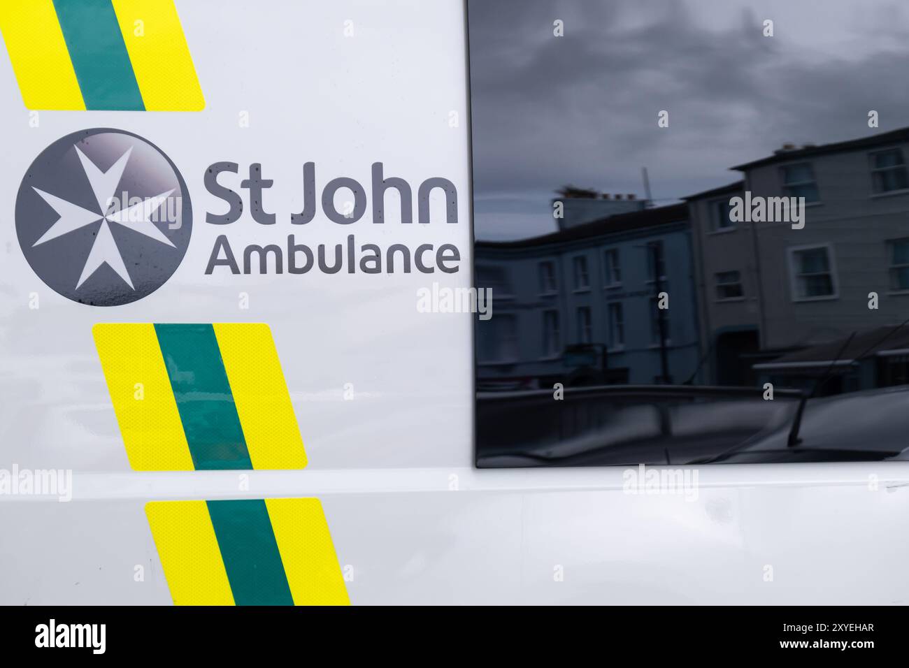 St John Ambulance logo with Maltese Cross on side of white vehicle ...