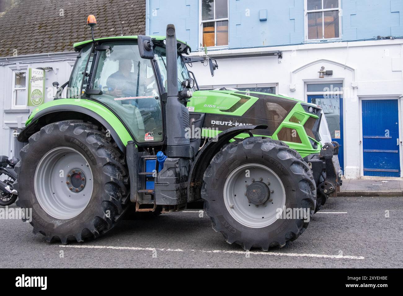 Large green Deutz-Fahr 6165 Agrotron tractor taking part in tractor run ...