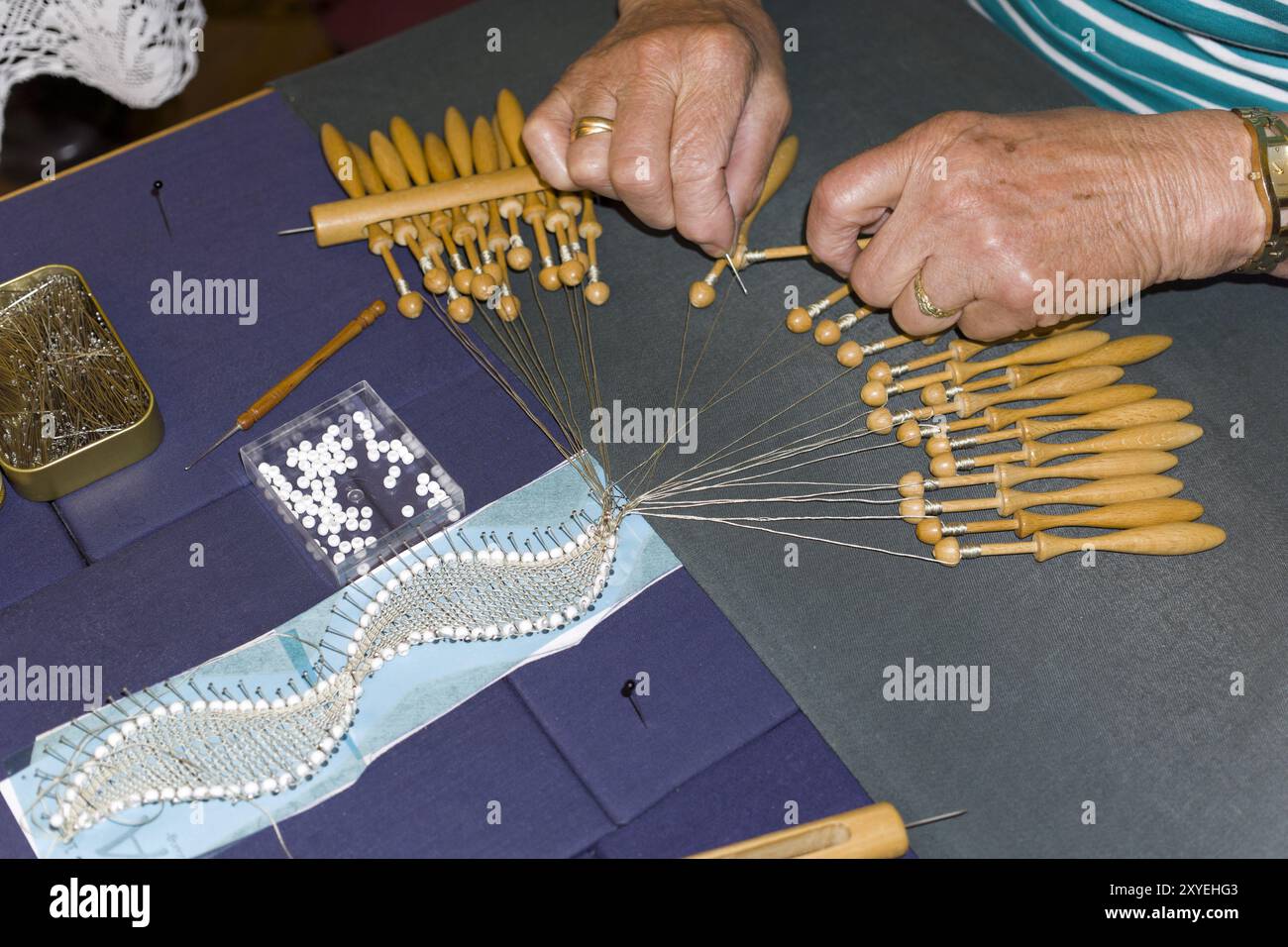 Elderly woman making lace according to old handicraft technique Stock ...