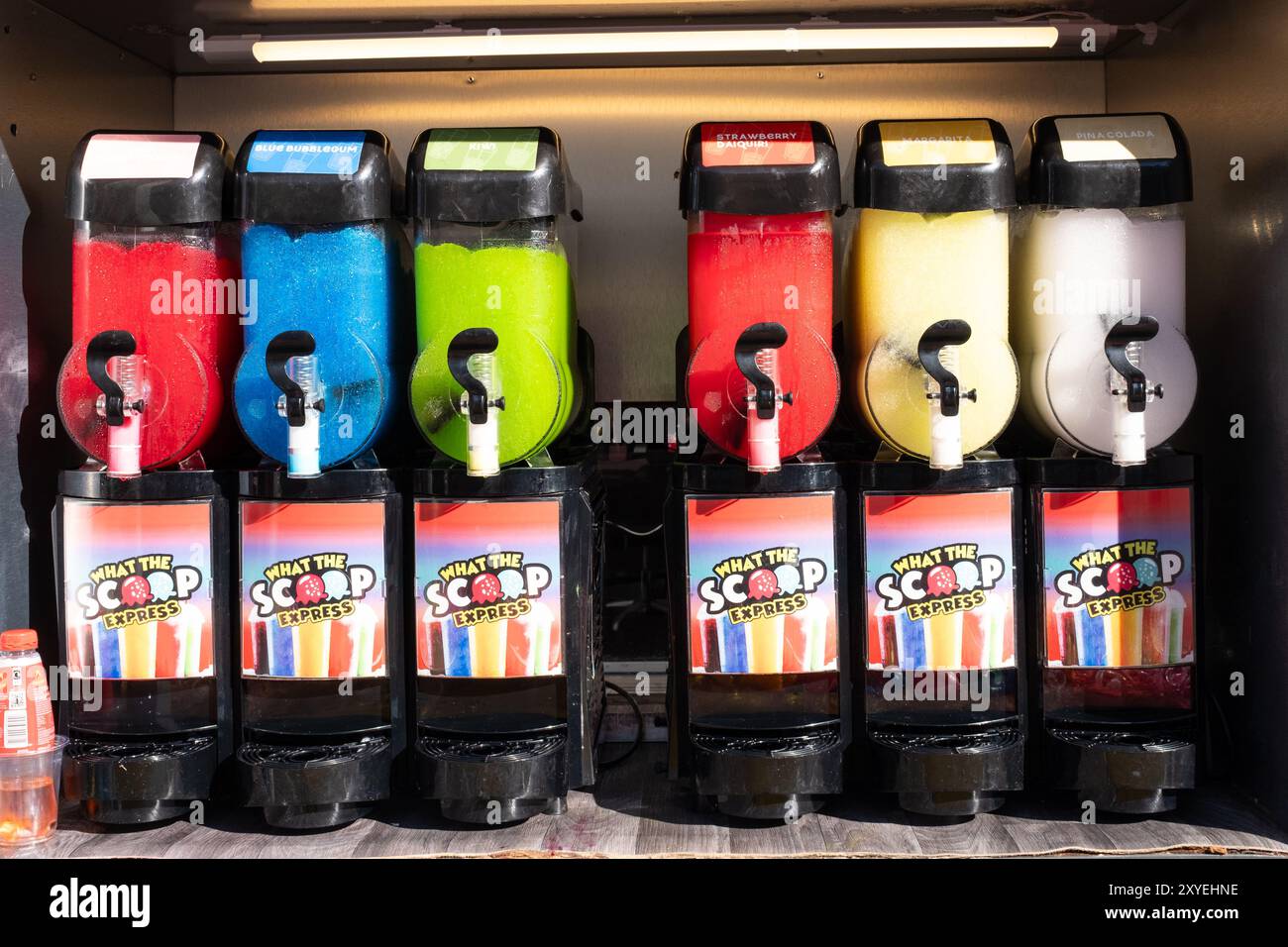 Row of colourful refreshing iced drinks, ready mixed, exotic flavours ...