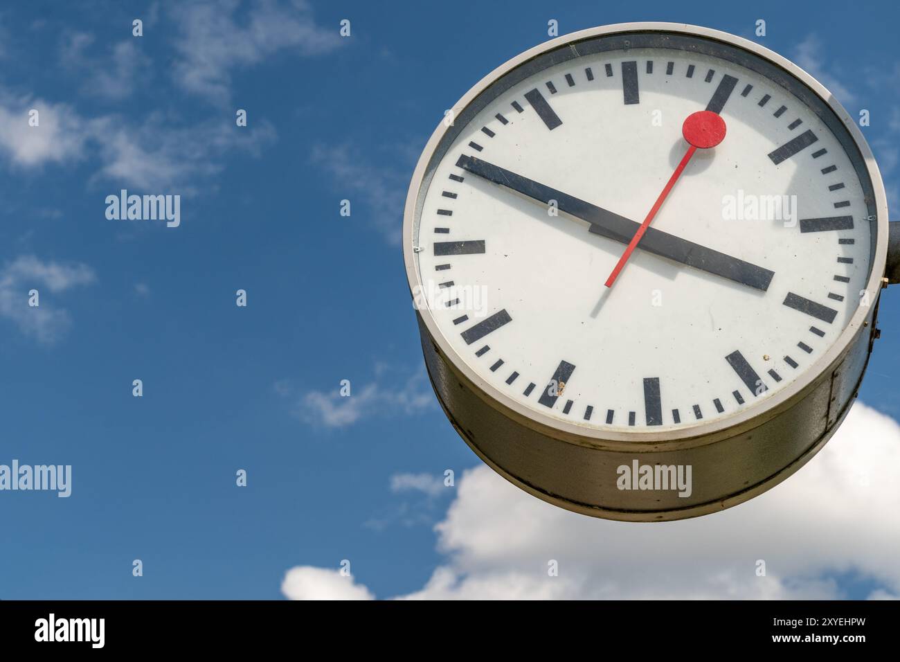 Typical Swiss Clock at train stations in Switzerland, blue sky ...