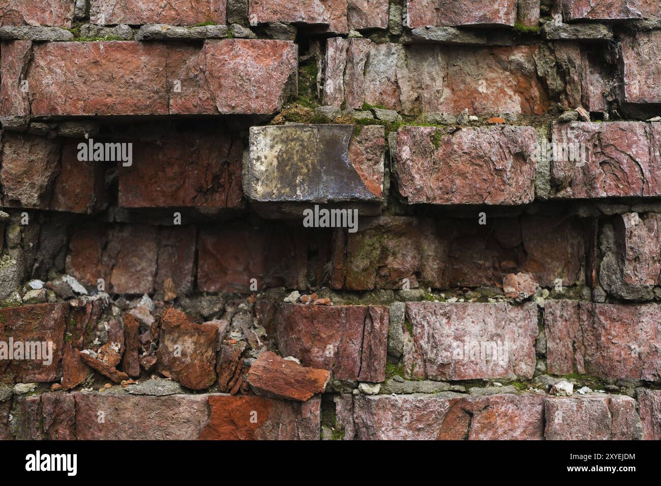 Grunge background Old brick wall weathered and falling apart. The ...