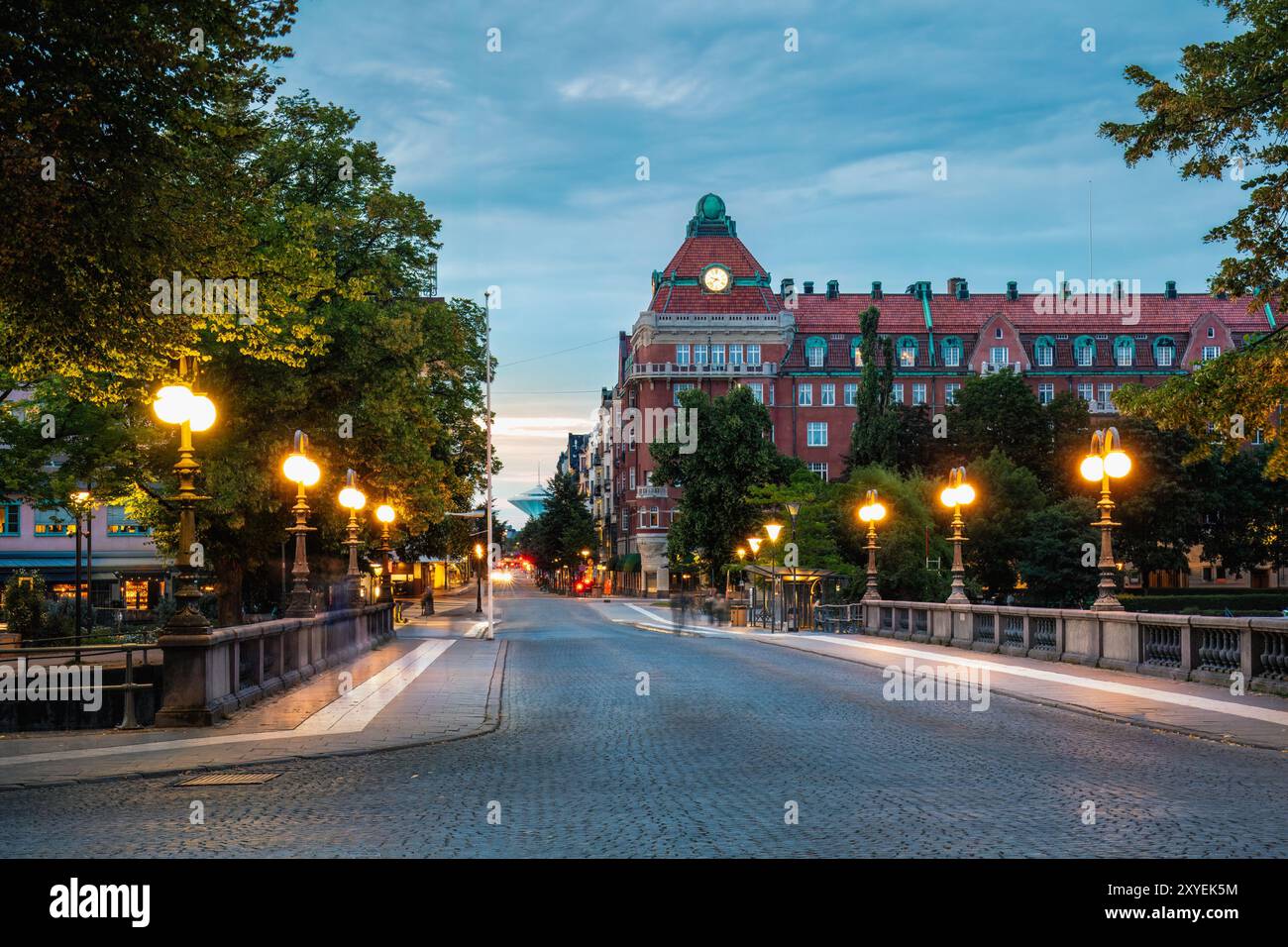 Evening view to the main street with vintage street lamps, cobblestone ...